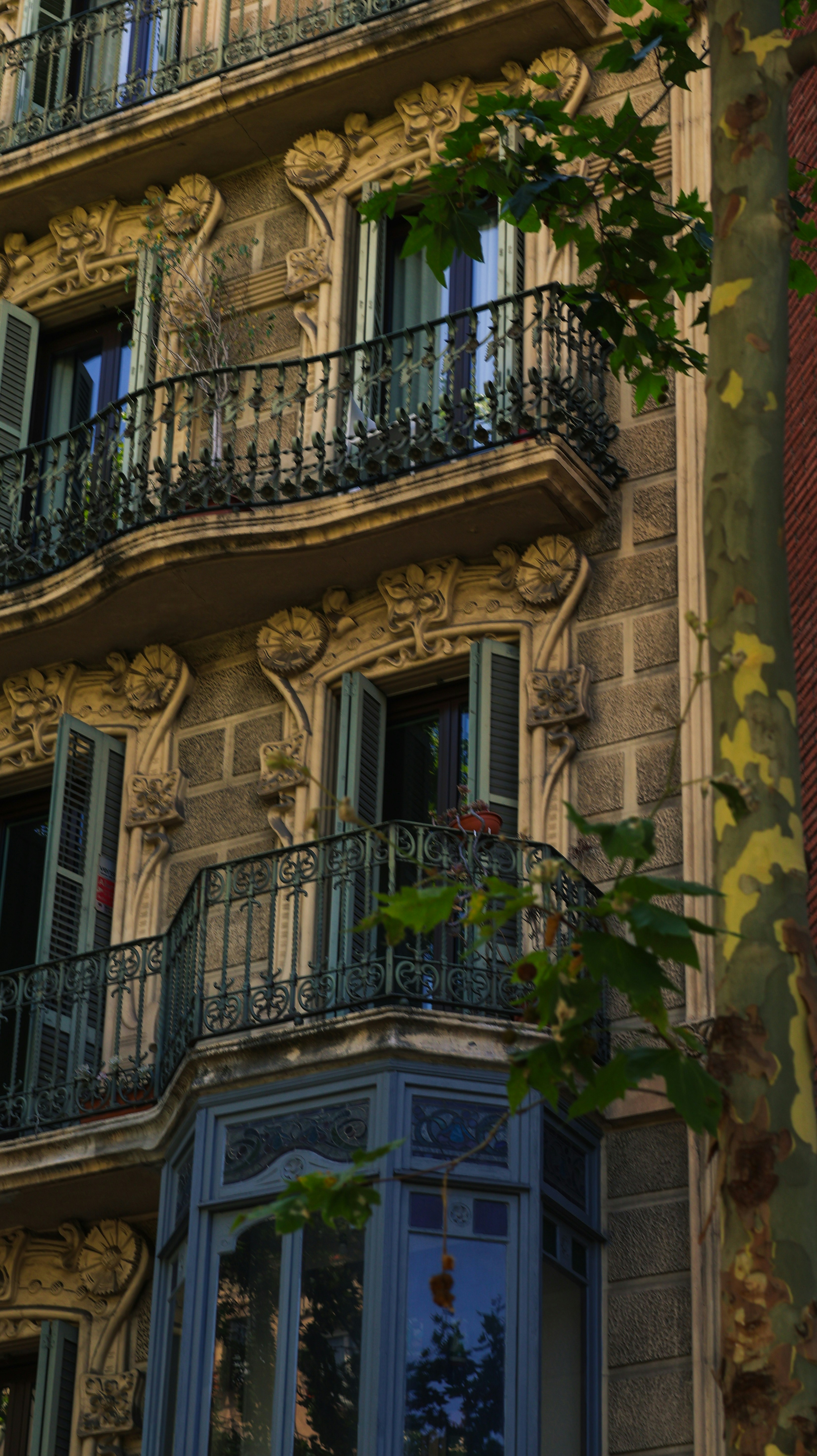 Ornate Balcony Facade: Florence-influenced detailing on a sunlit stone building