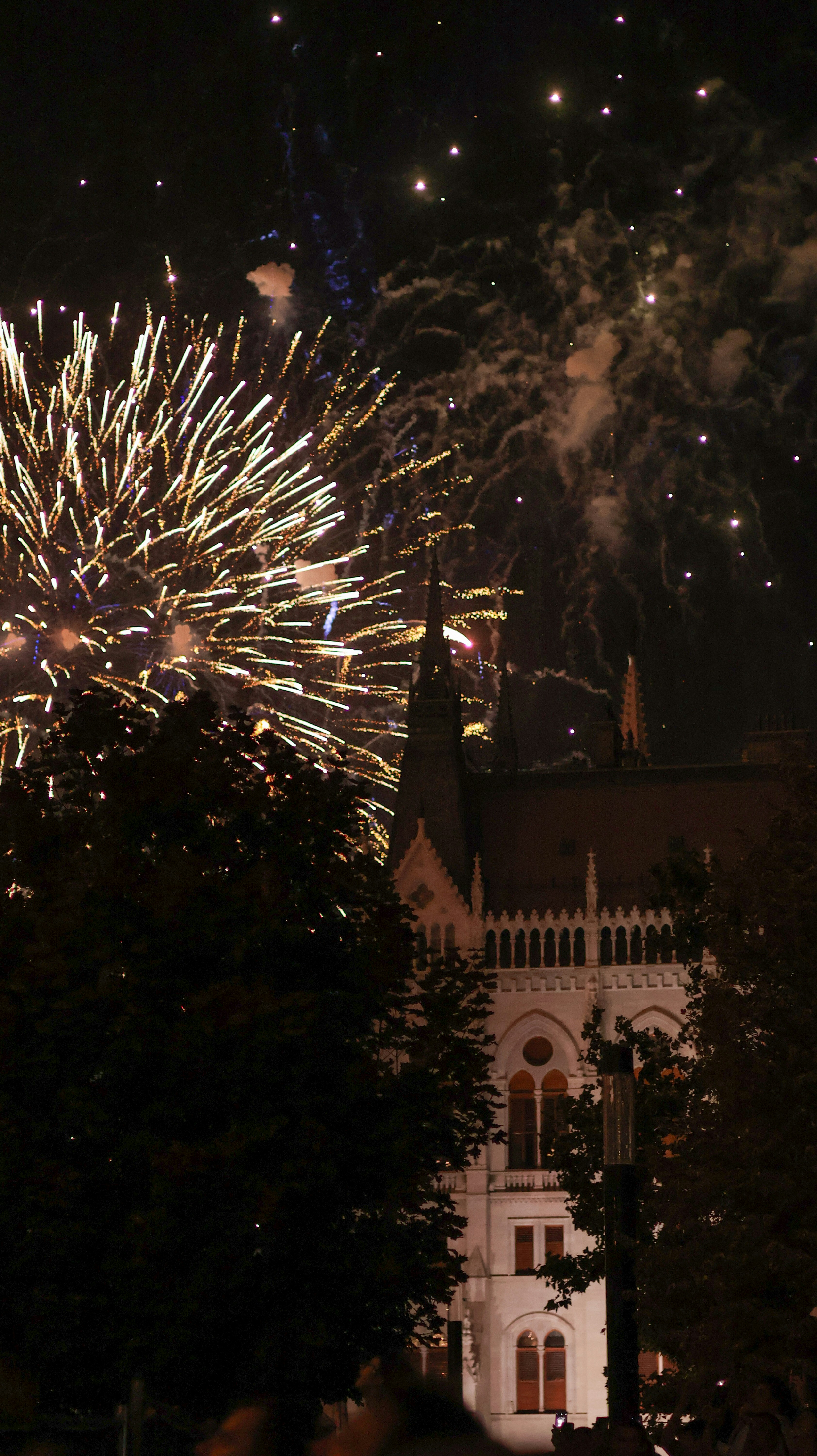 Firework Curtain Behind a Historic Gable at Night