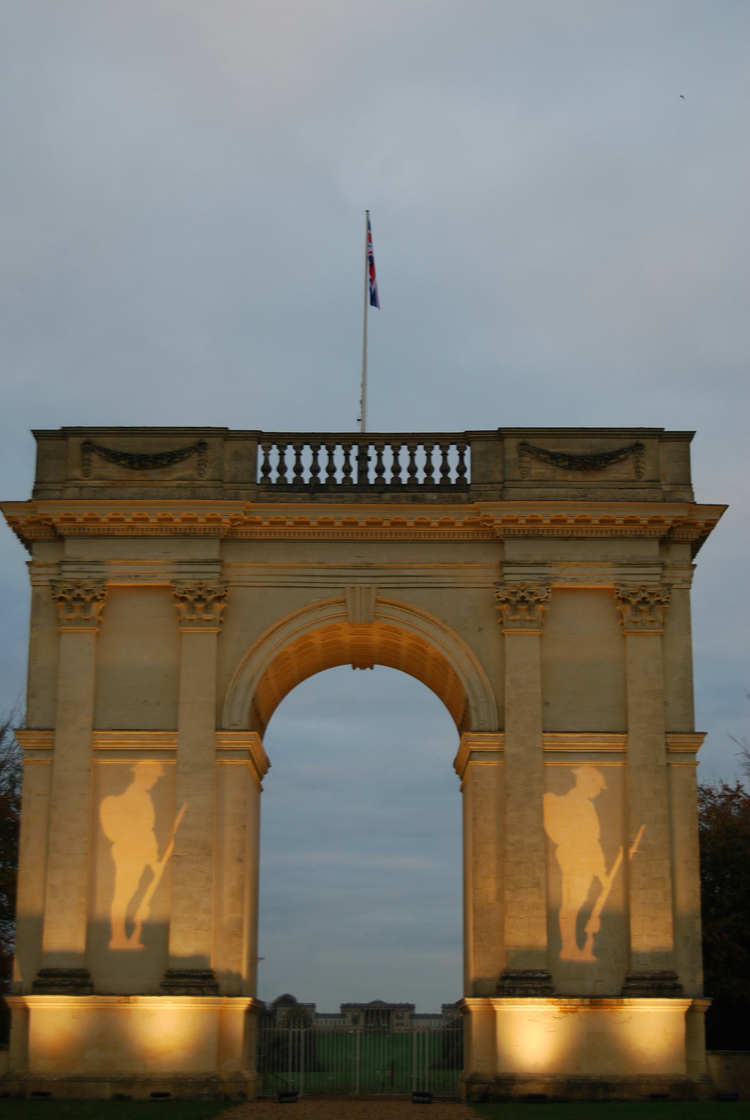 Golden Arch at Dusk: Illuminated Monument Framing the Open Field
