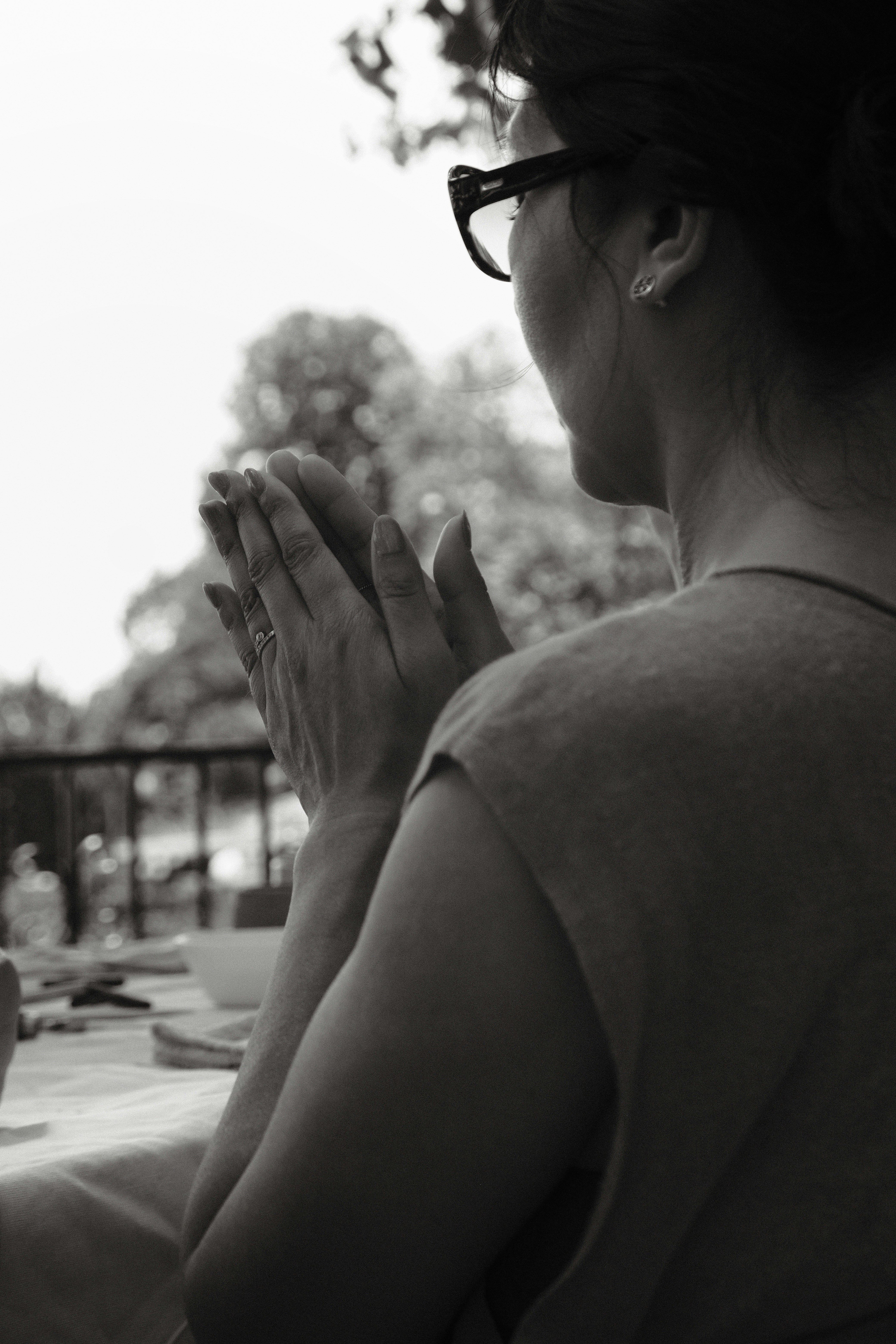 A Moment of Quiet Prayer: Hands in Focus at the Table