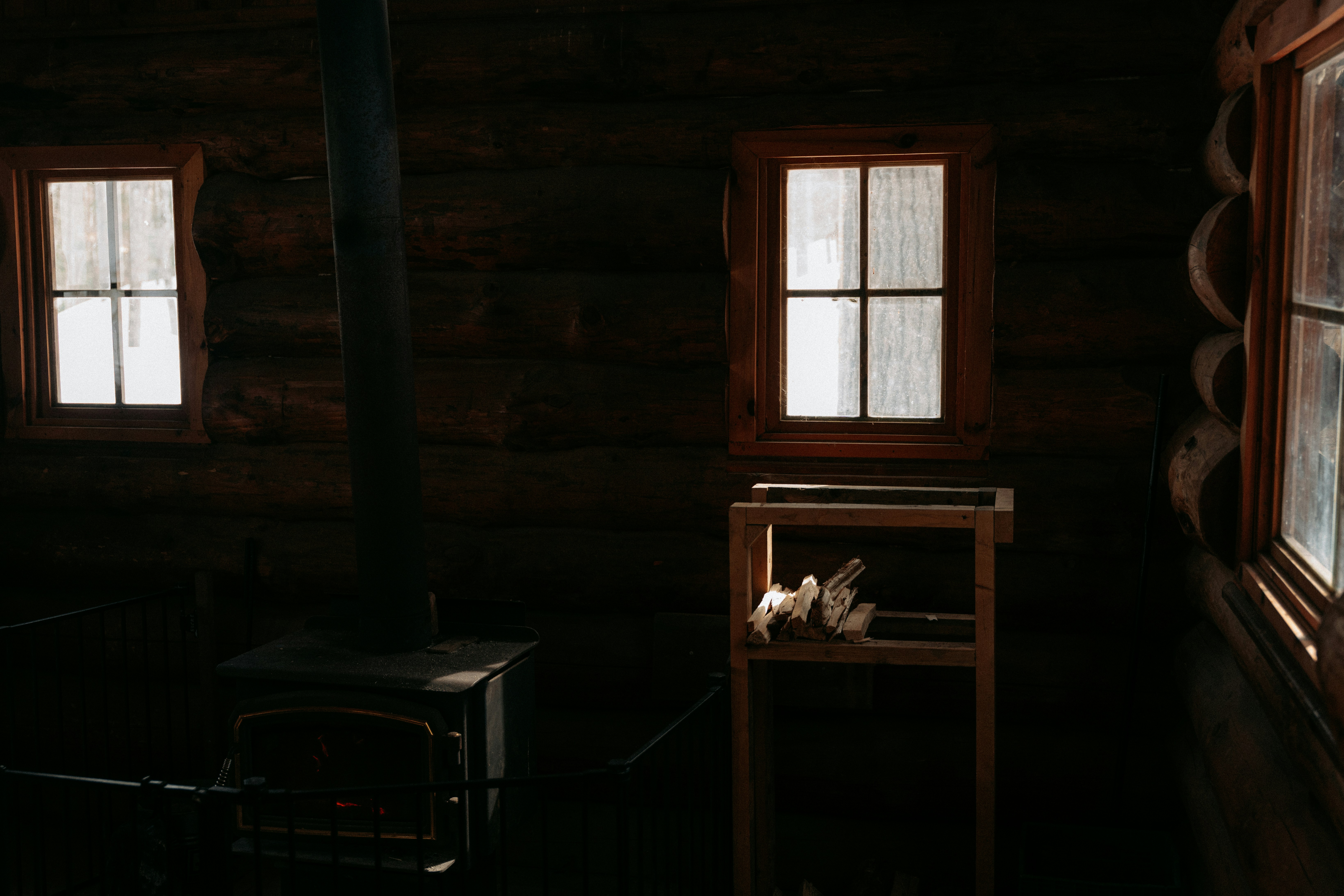 Cozy Stove Glow in a Log Cabin