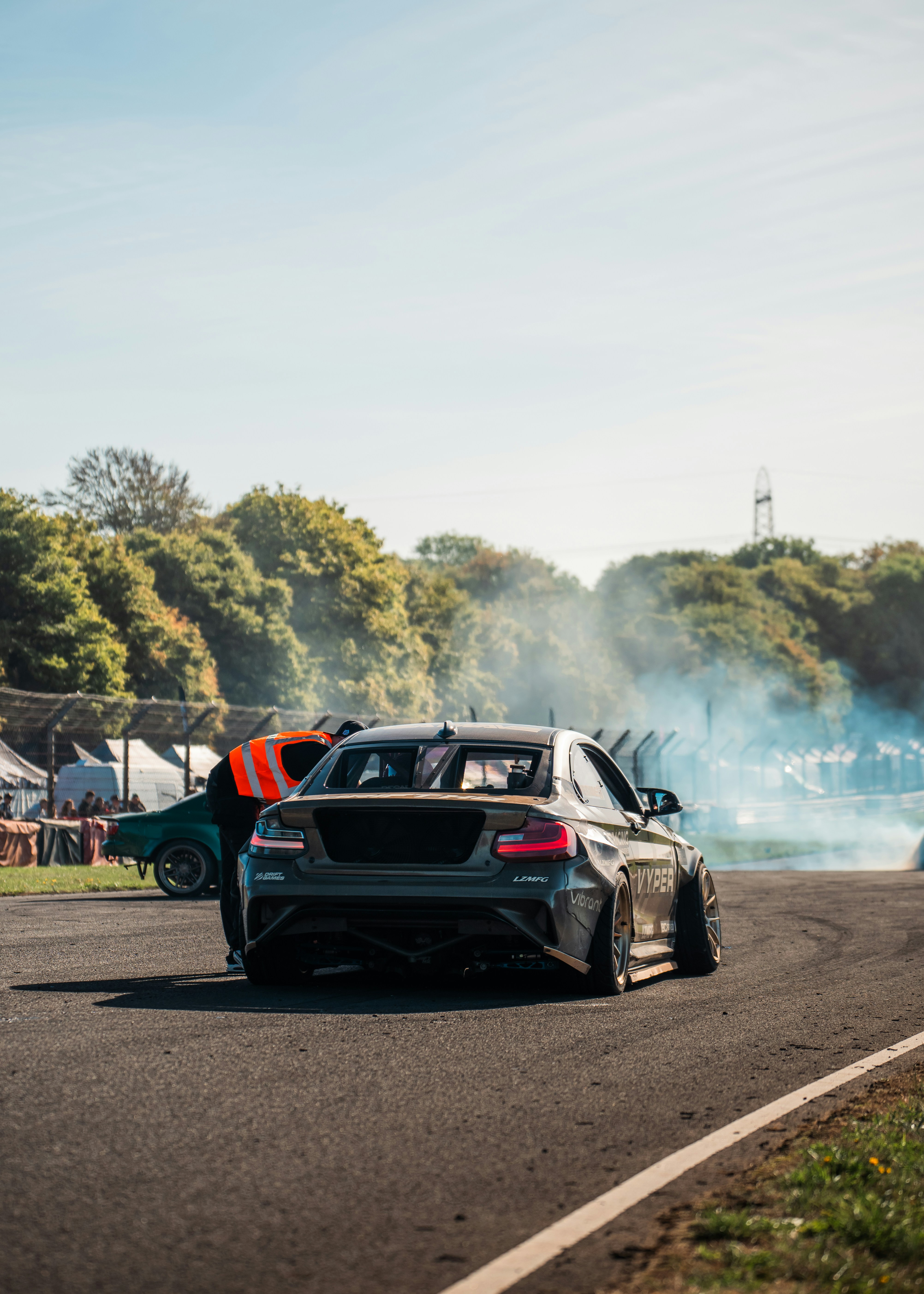 Backlit Drift: A Porsche-laden Moment on the Burnout Strip