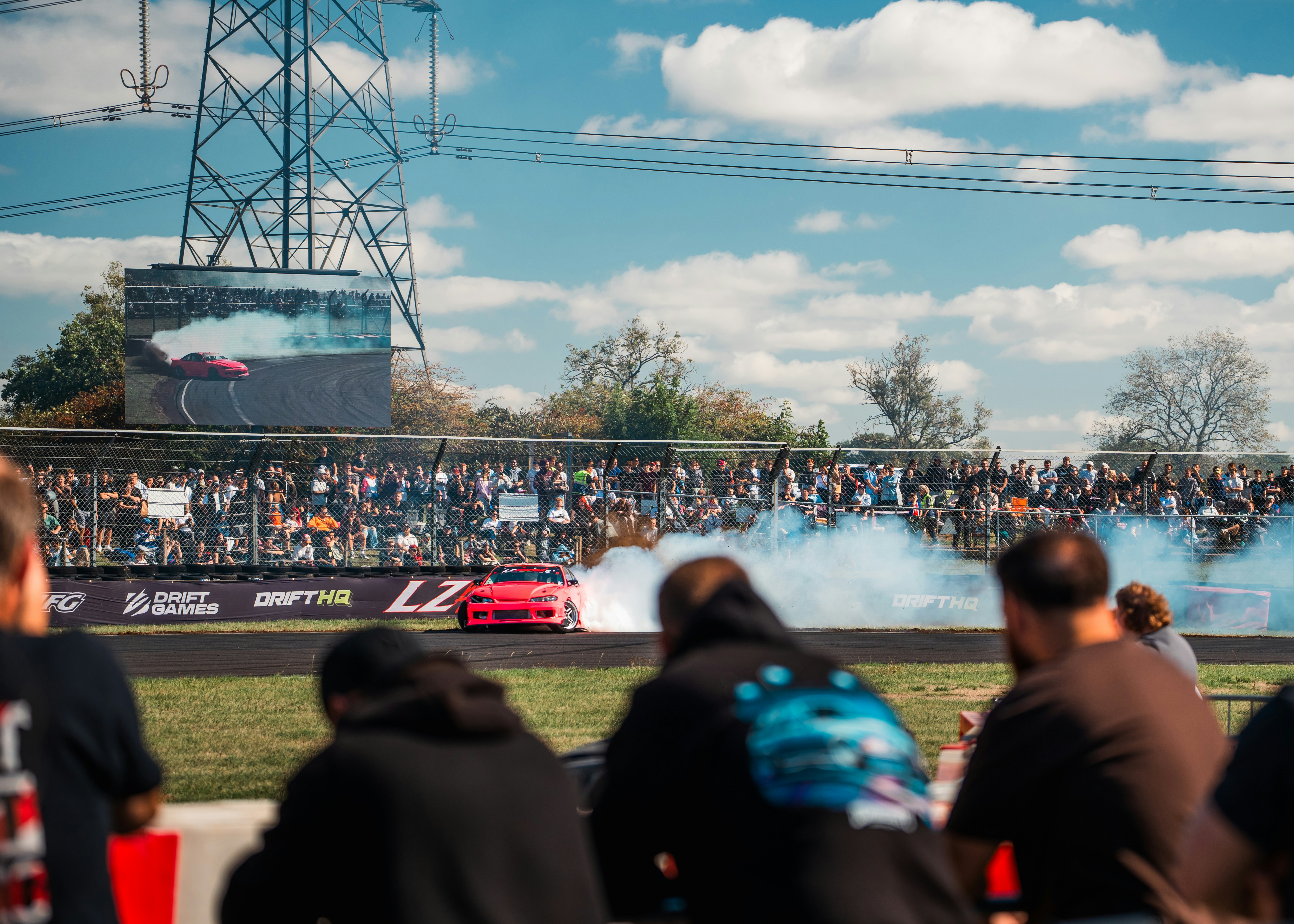 Red Drift Fireworks: A Red Car Pierces Through Smoke at the Track
