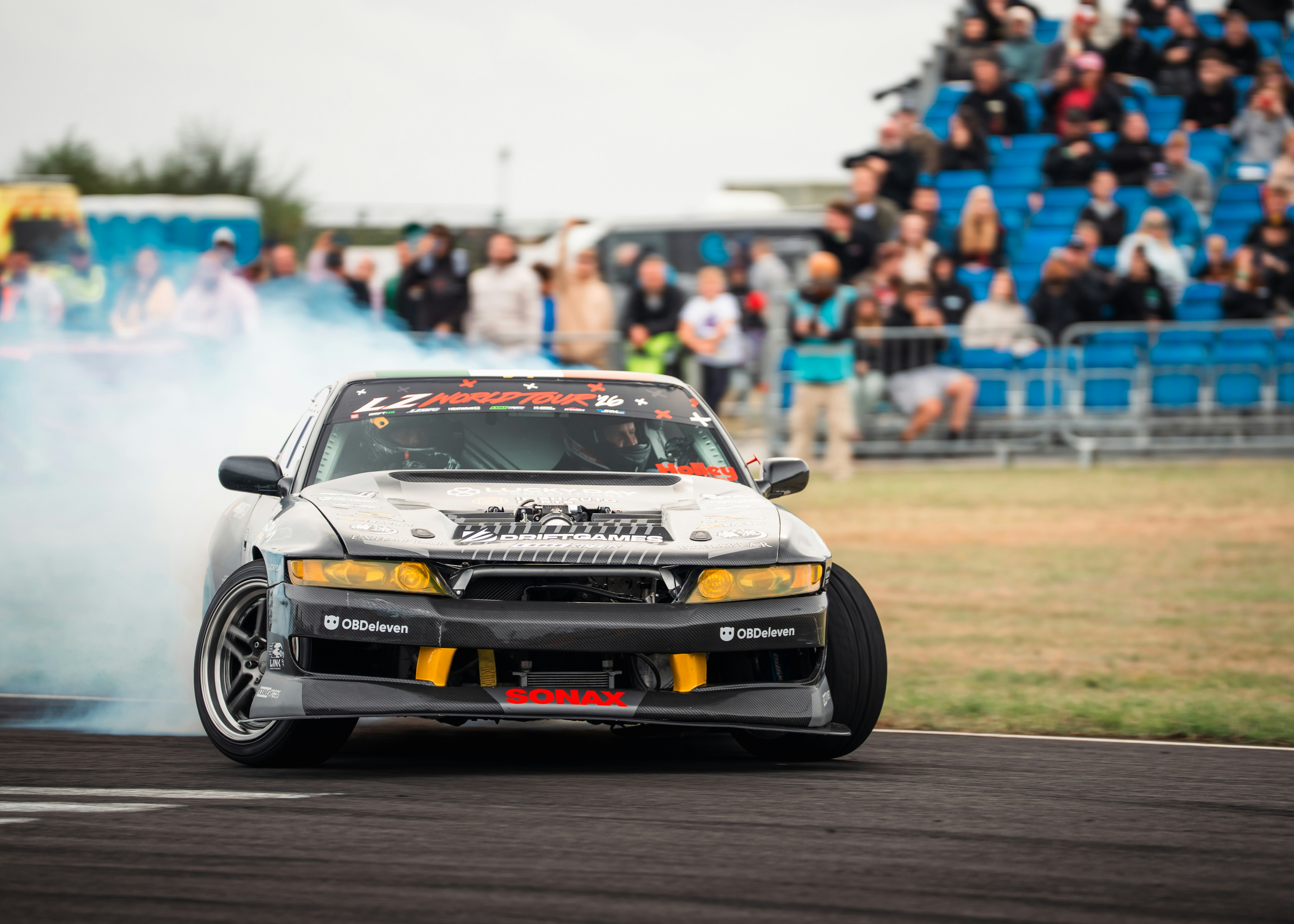 Smoke and Drift: A Nissan-Brewing Drift Under the Blue Stadium Lights