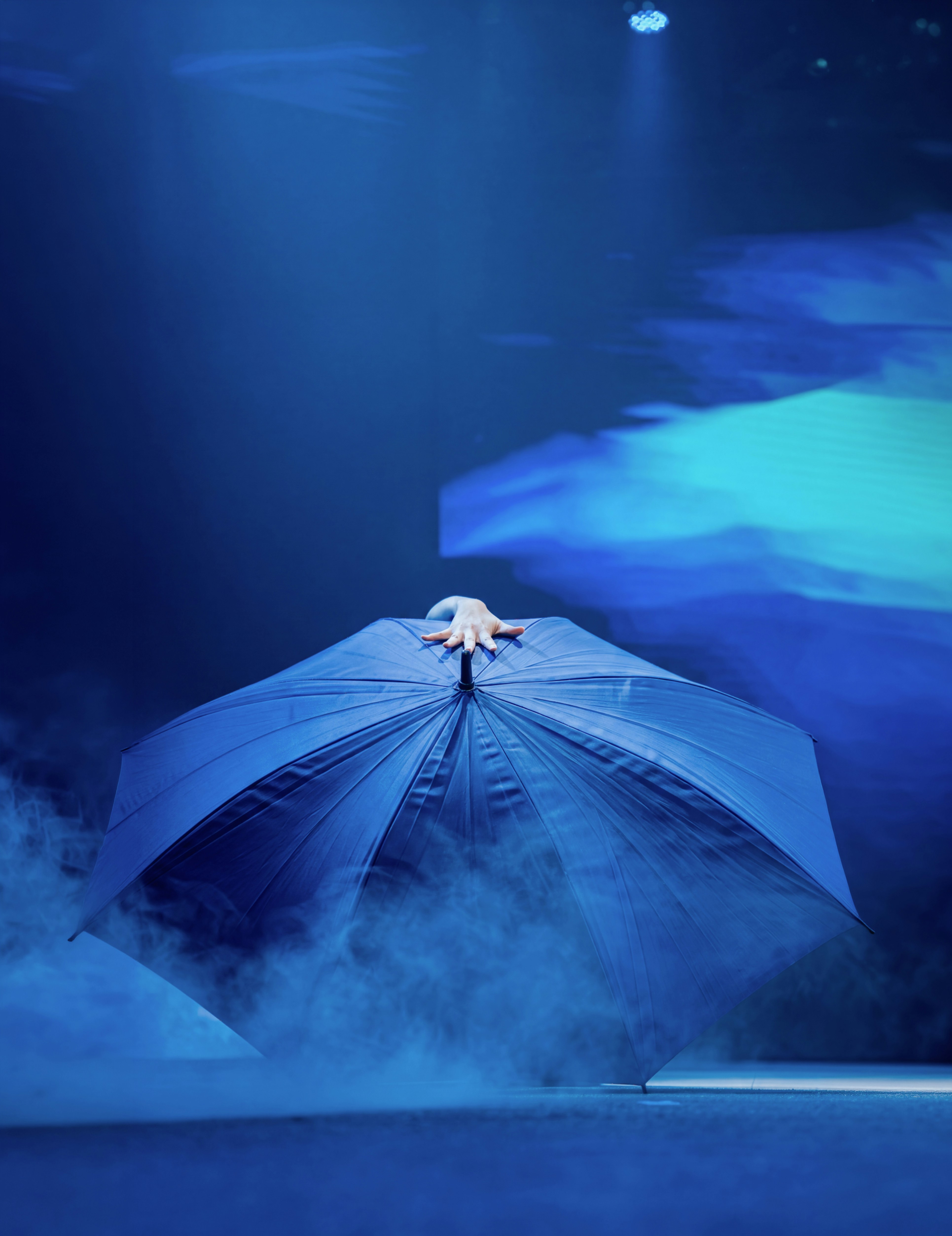 Umbrella Quiet: A Moment of Steady Hands Behind Blue Veil