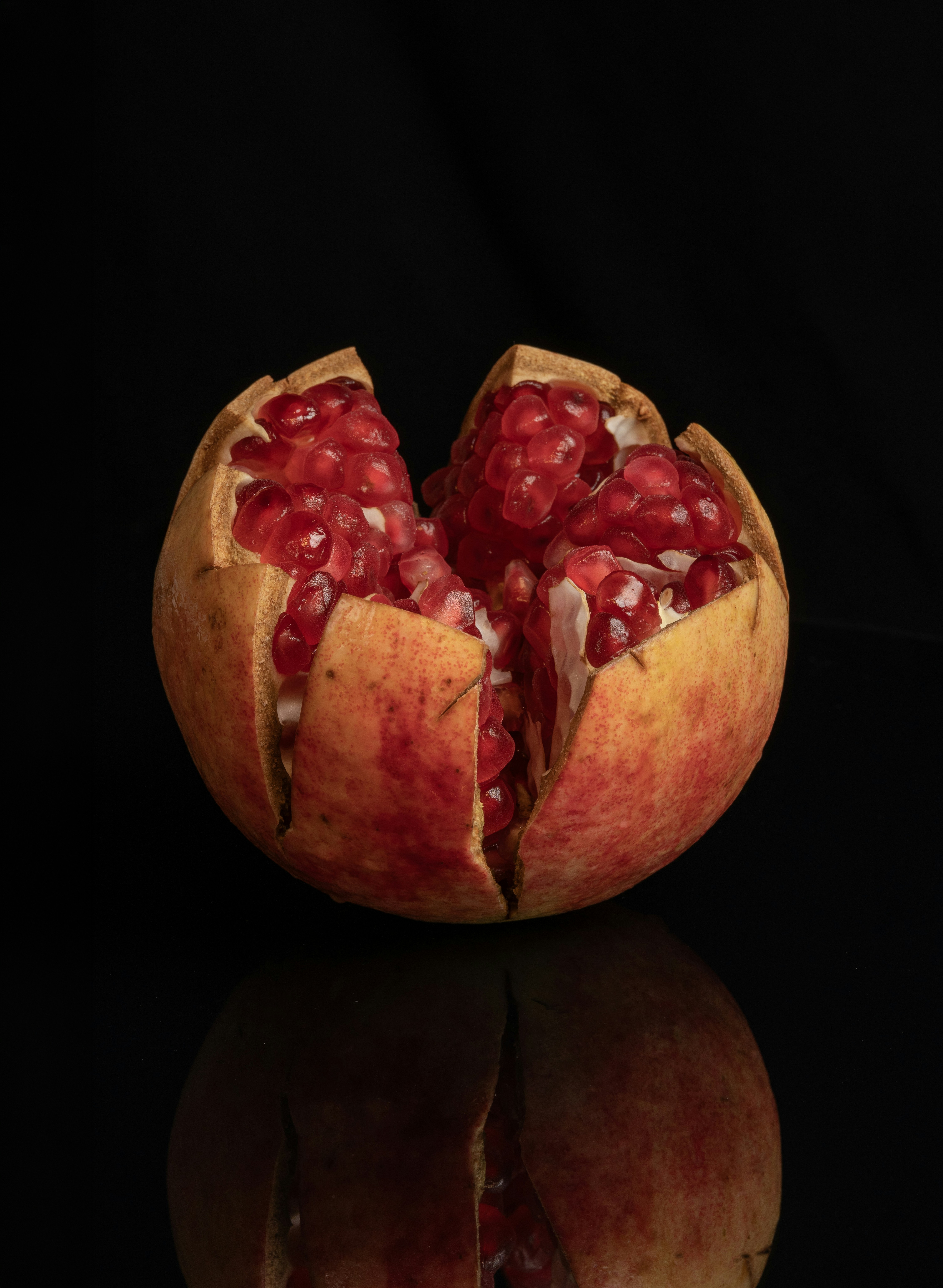 Cracked ruby within a velvet-dark hush