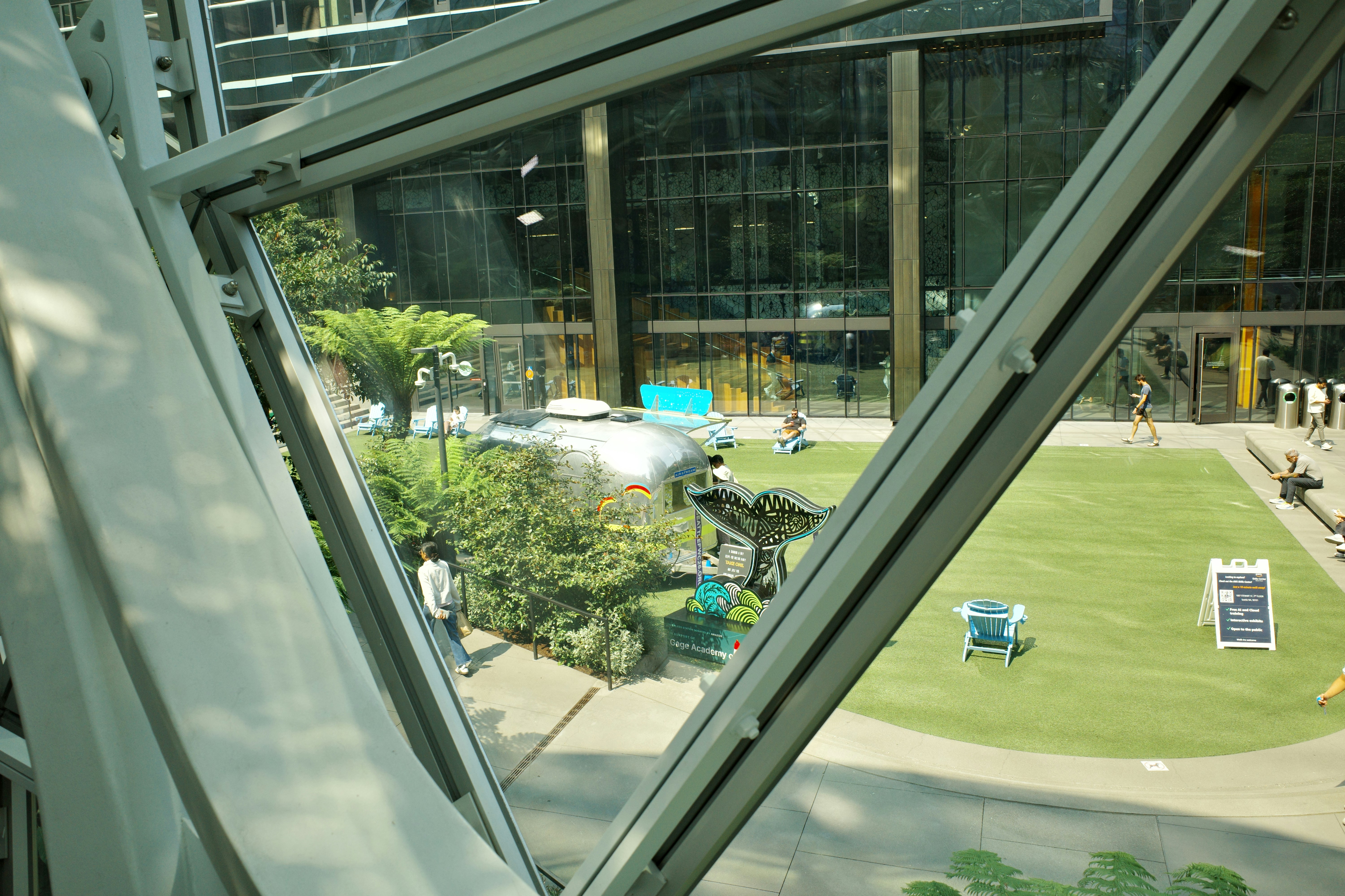 Glass Crescent Across a Courtyard Vista