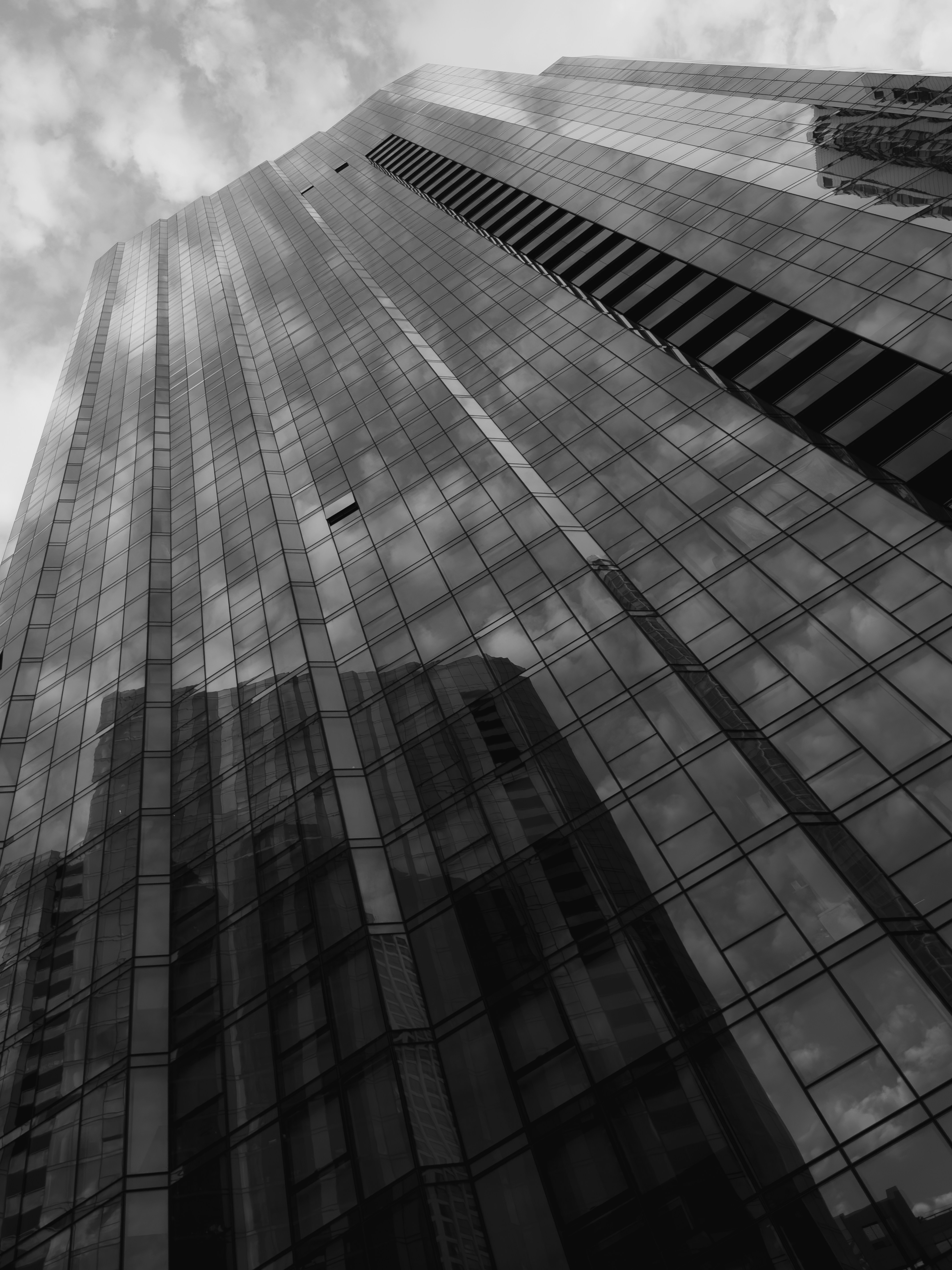 Vertical Ascent: Glass Facade Reaching Toward the Sky