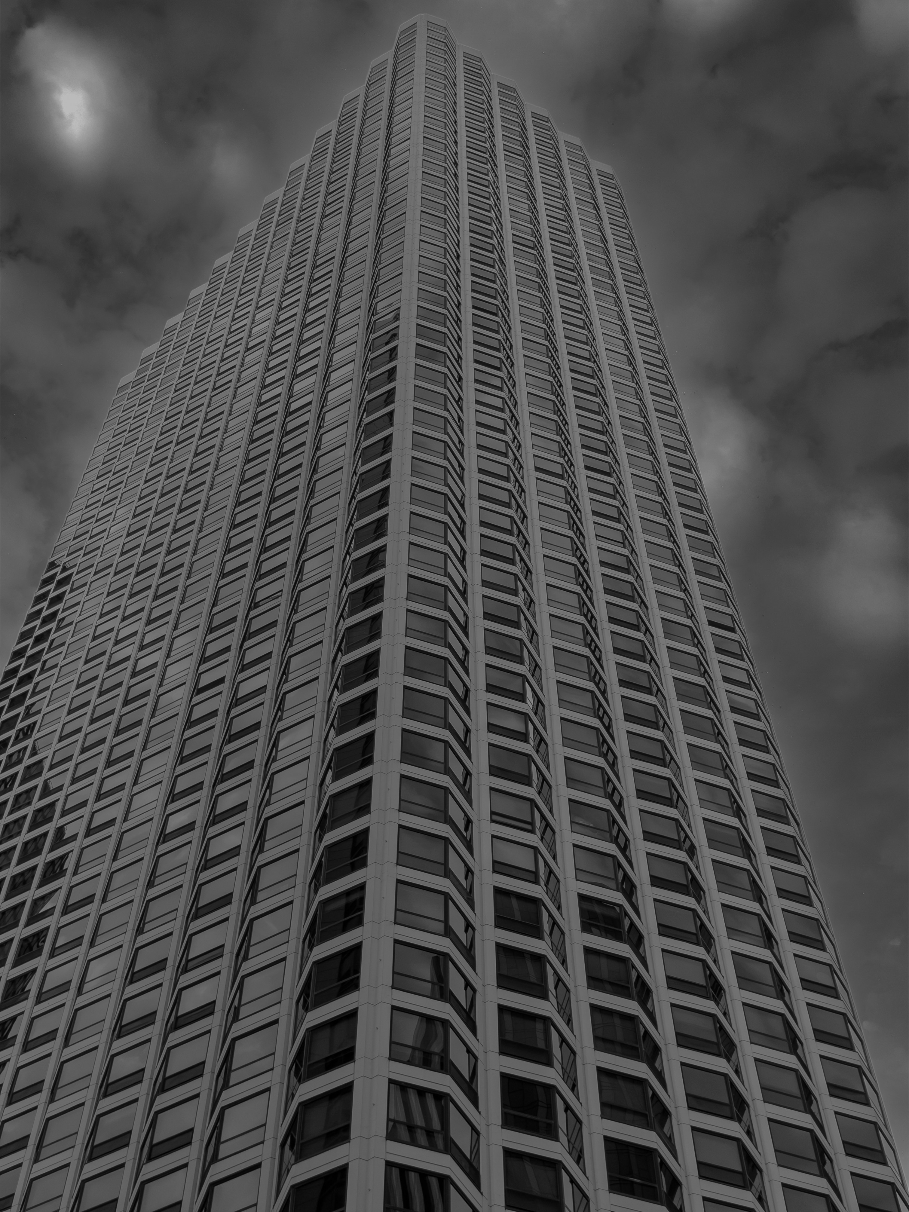 Tower Ascend: A Monolithic Facade Reaching the Clouds