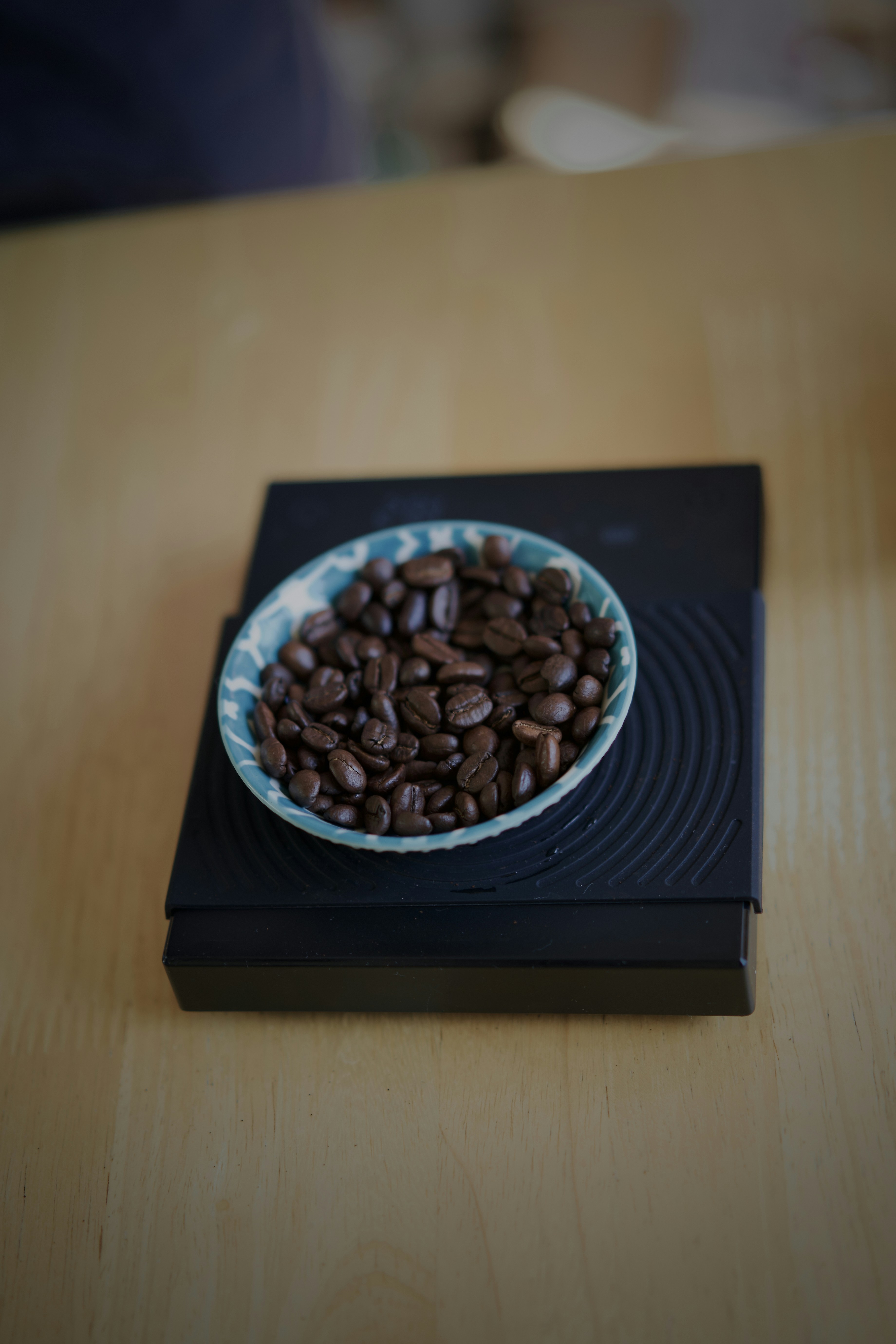 Chocolate Focus: A Bowl of Coffee Beans Reposes on a Slotted Modern Tray