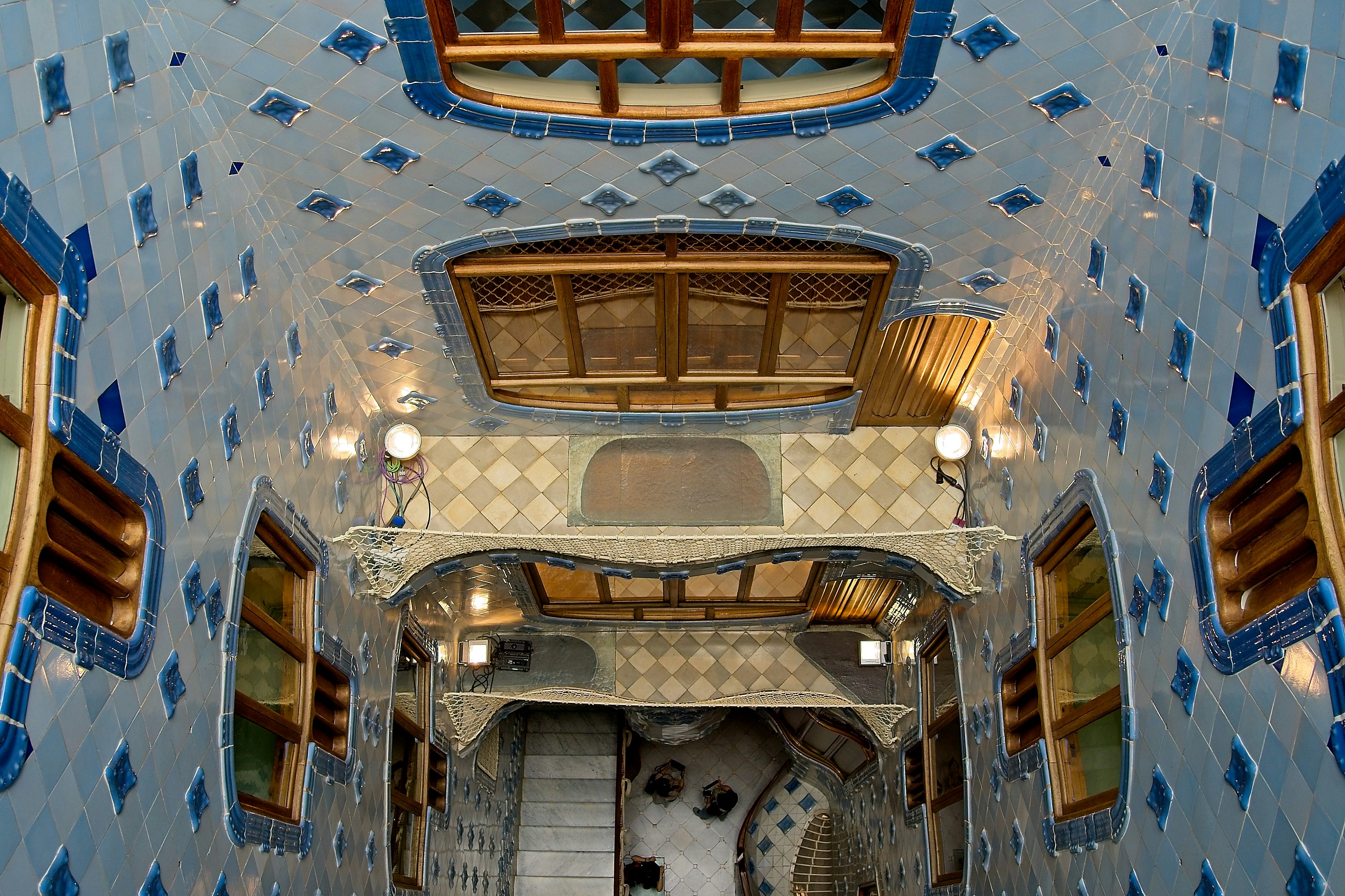 Azure Mosaic Corridor: Whimsical Tile Architecture Upward View