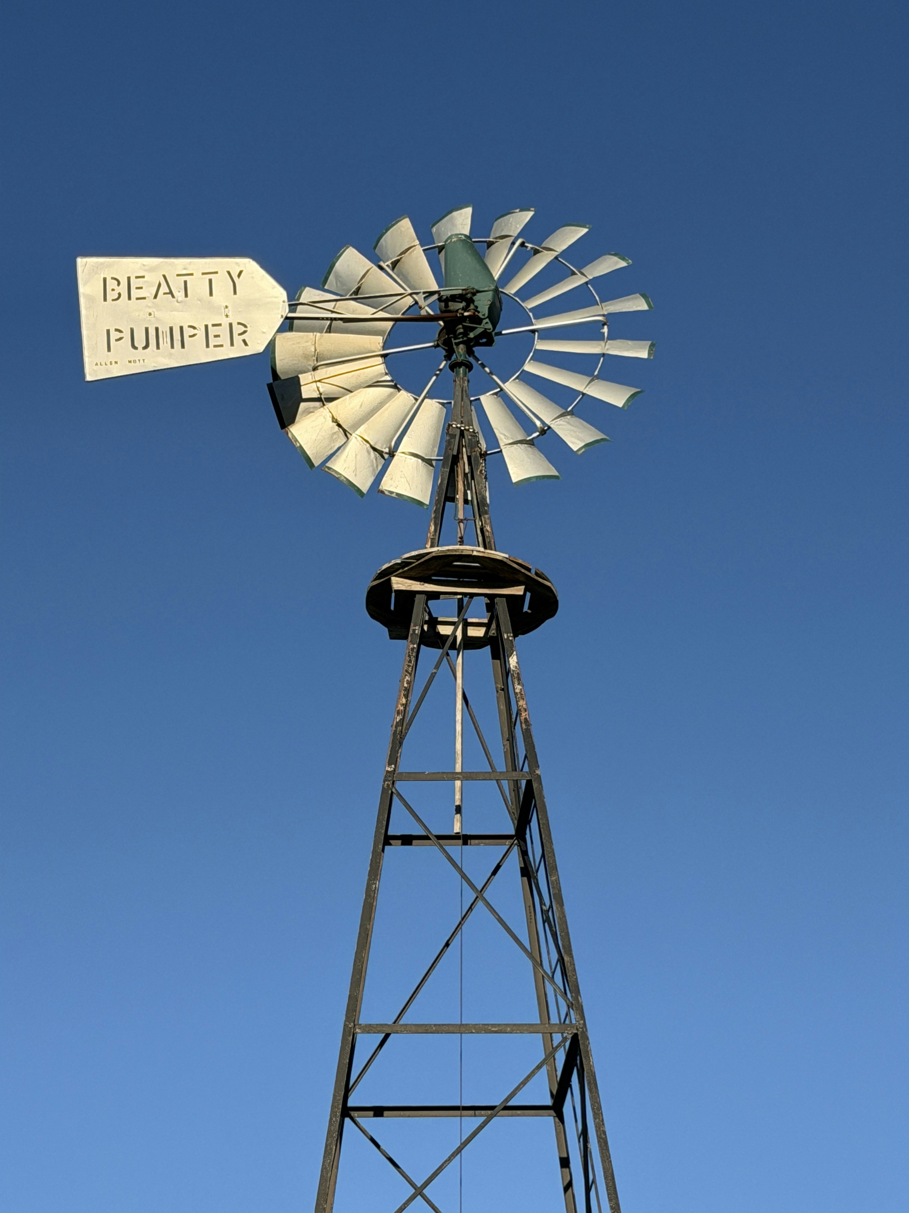 Windward Sentinel: A Windmill Crowned Against a Clear Blue Sky