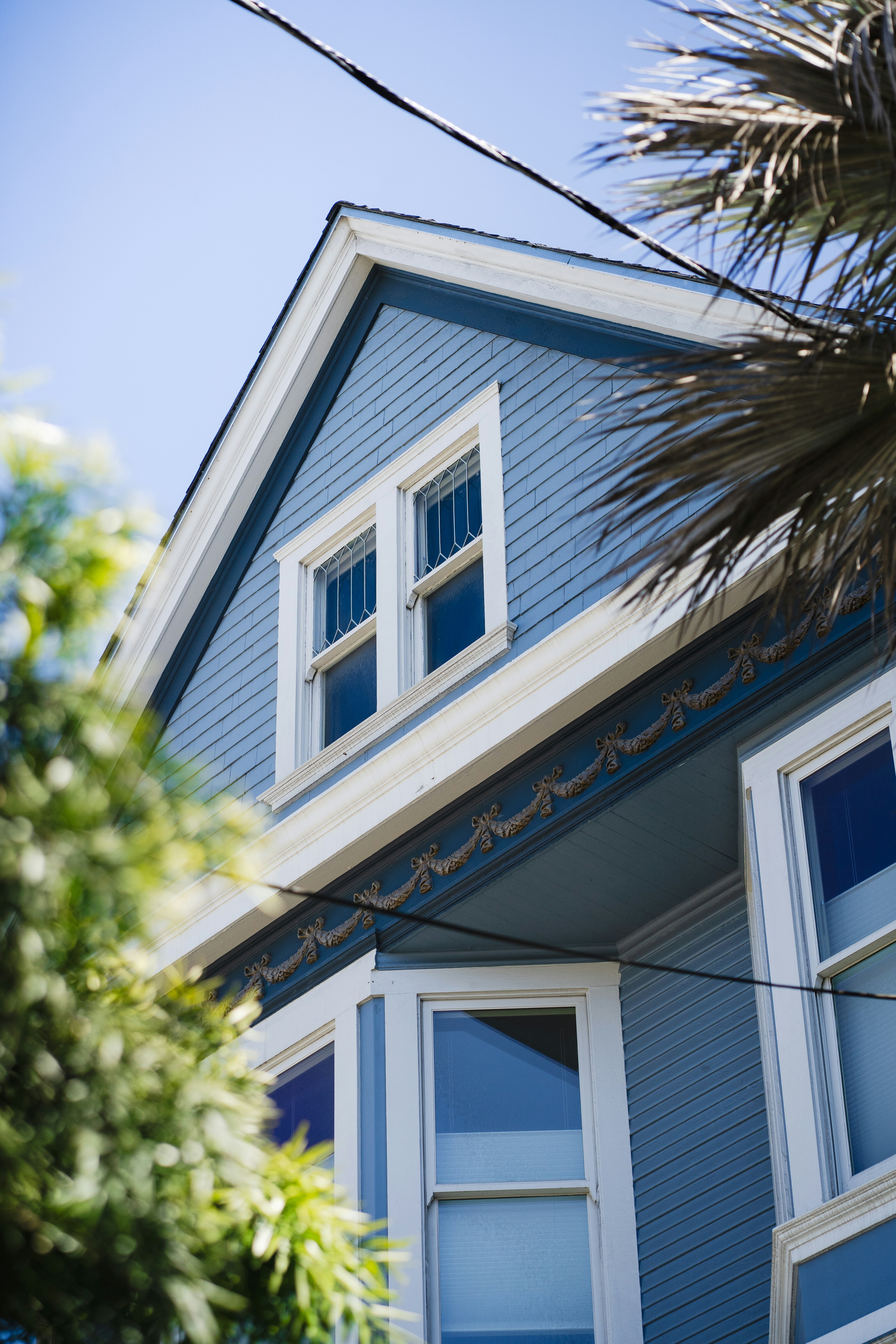 Sunlit Blue Cottage Gable with White Trim
