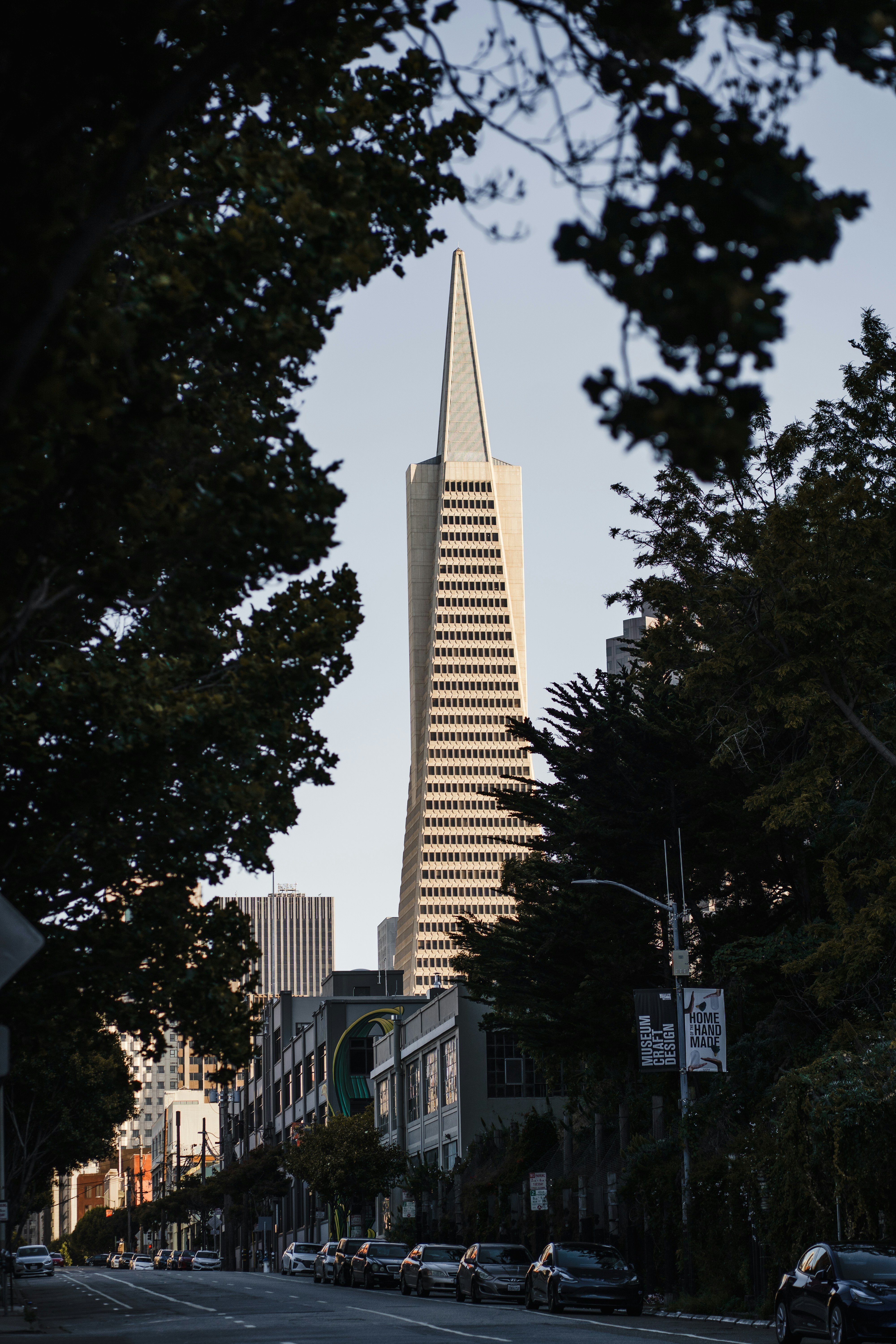 The Needle Reaches the Sky: San Francisco-Style Tower Framed by Street Life