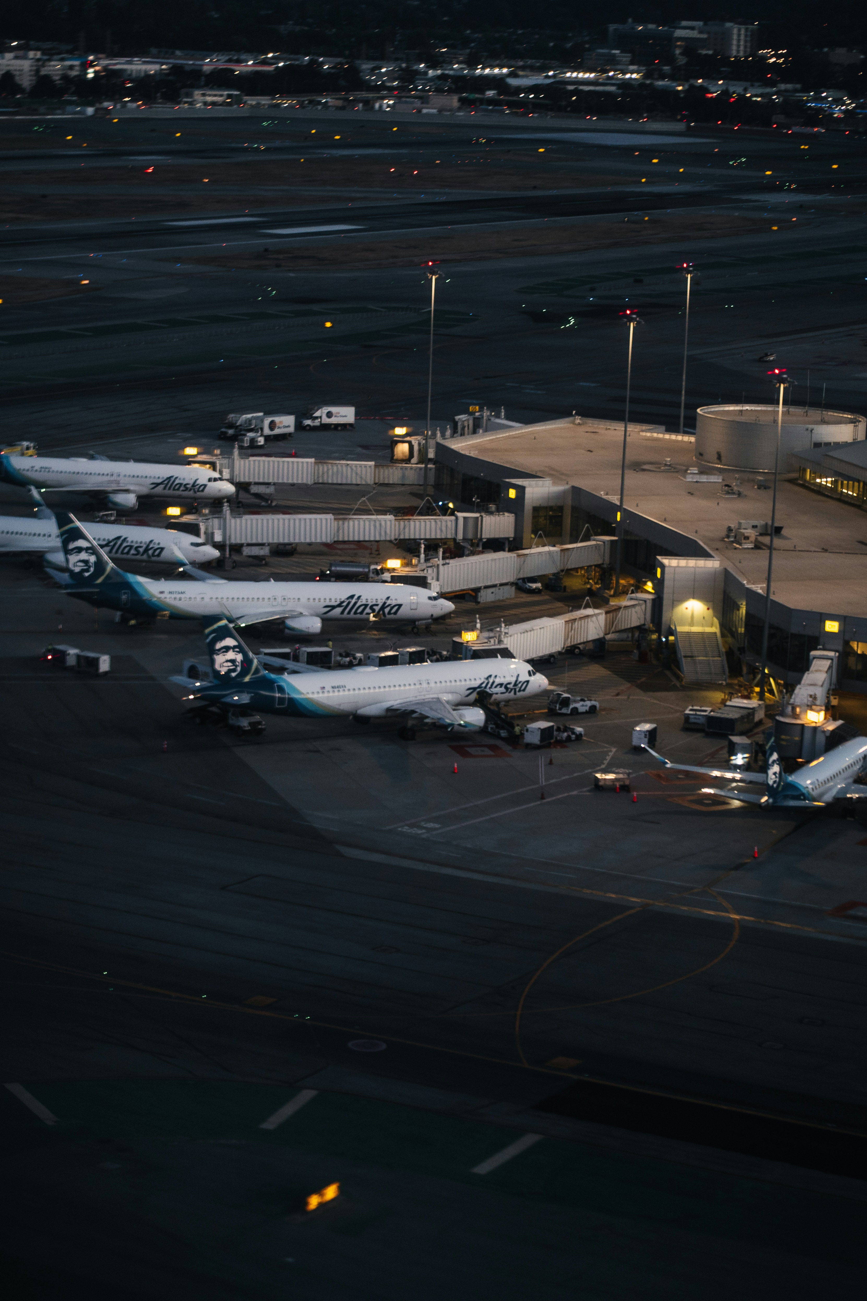 Evening Gate: Aircraft at the Jet Bridge in Quiet Apron Lights