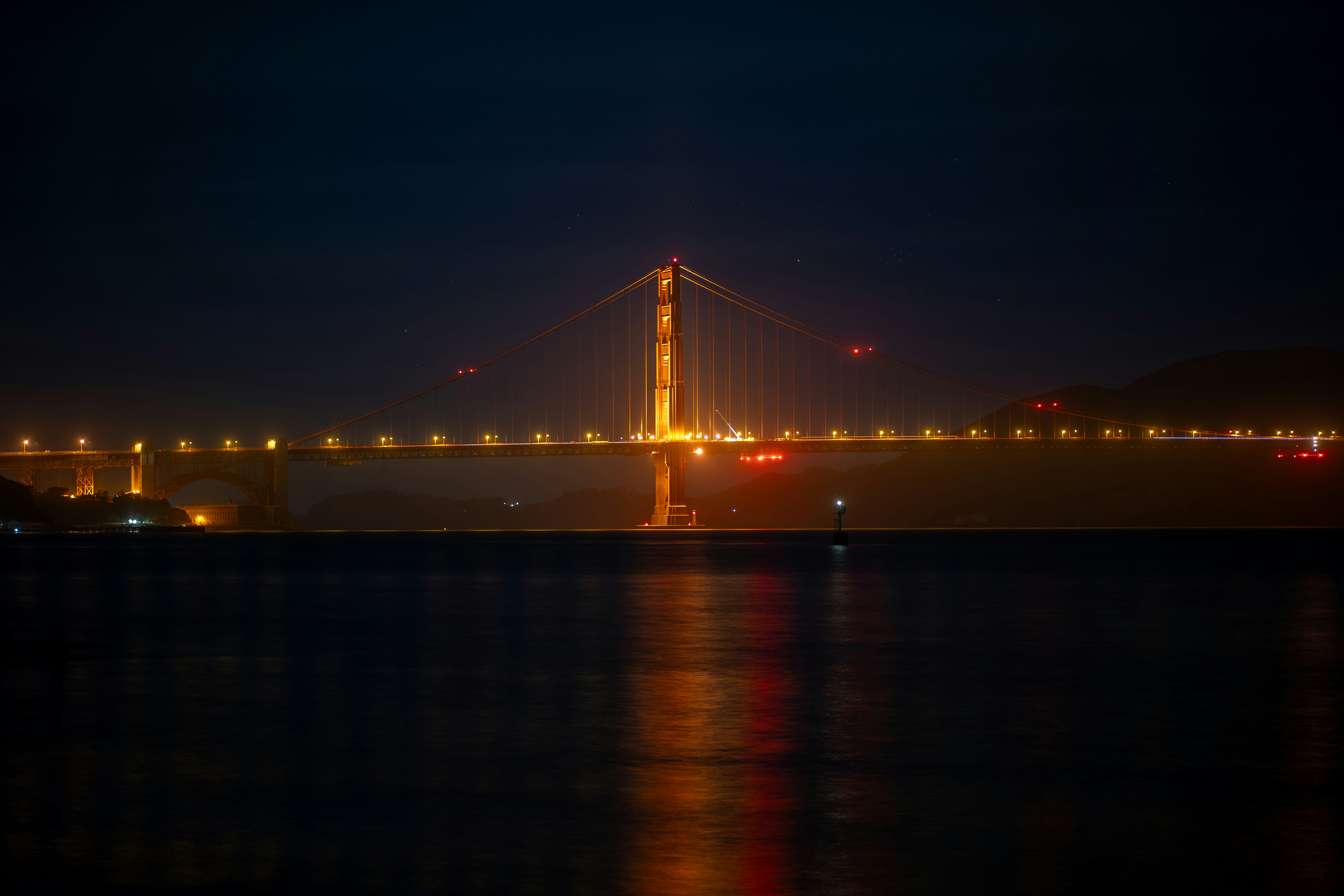 Golden Arc: Night Glow over the Bay Bridge