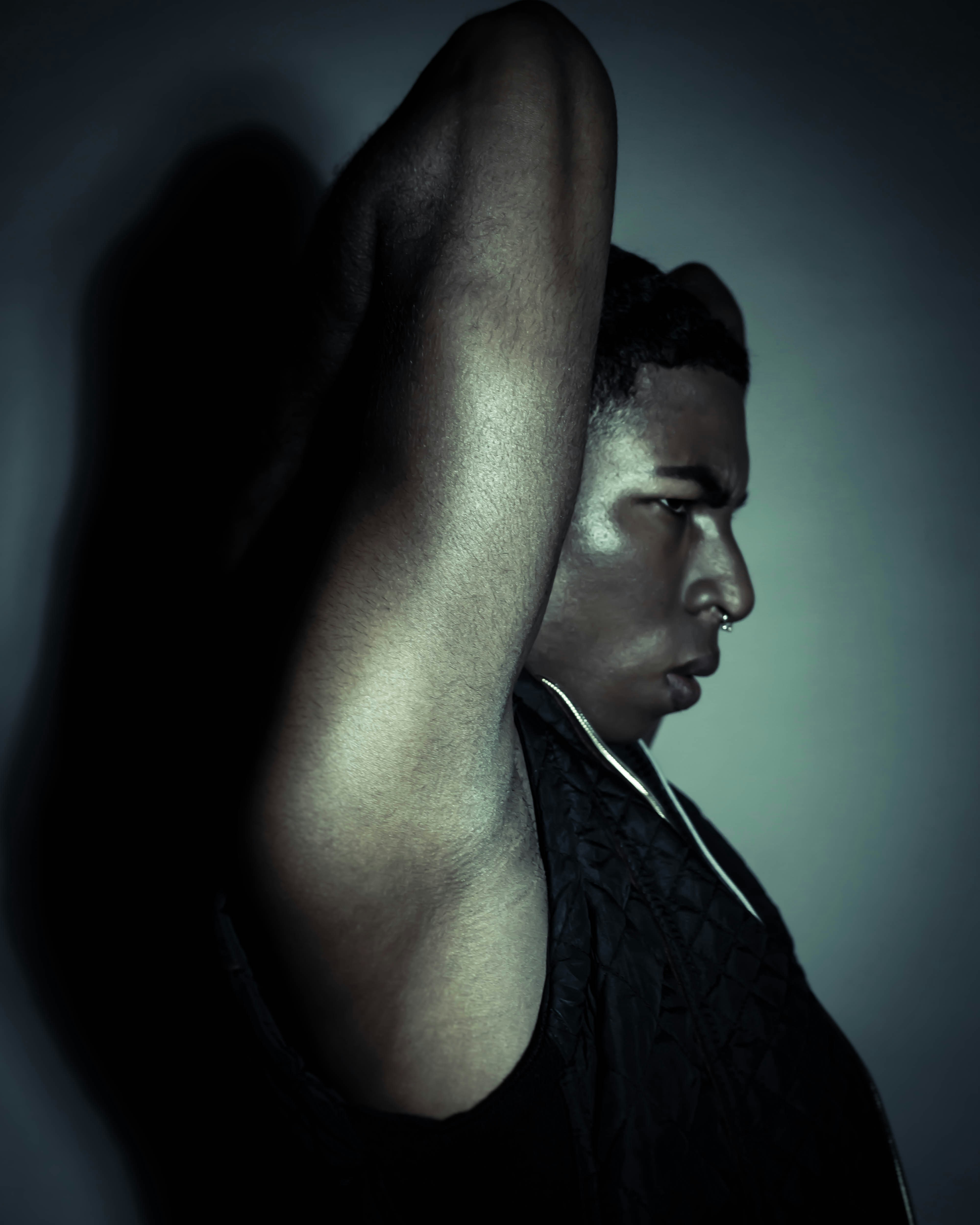 Shadowed Resolve: A Portrait in Deep Hue