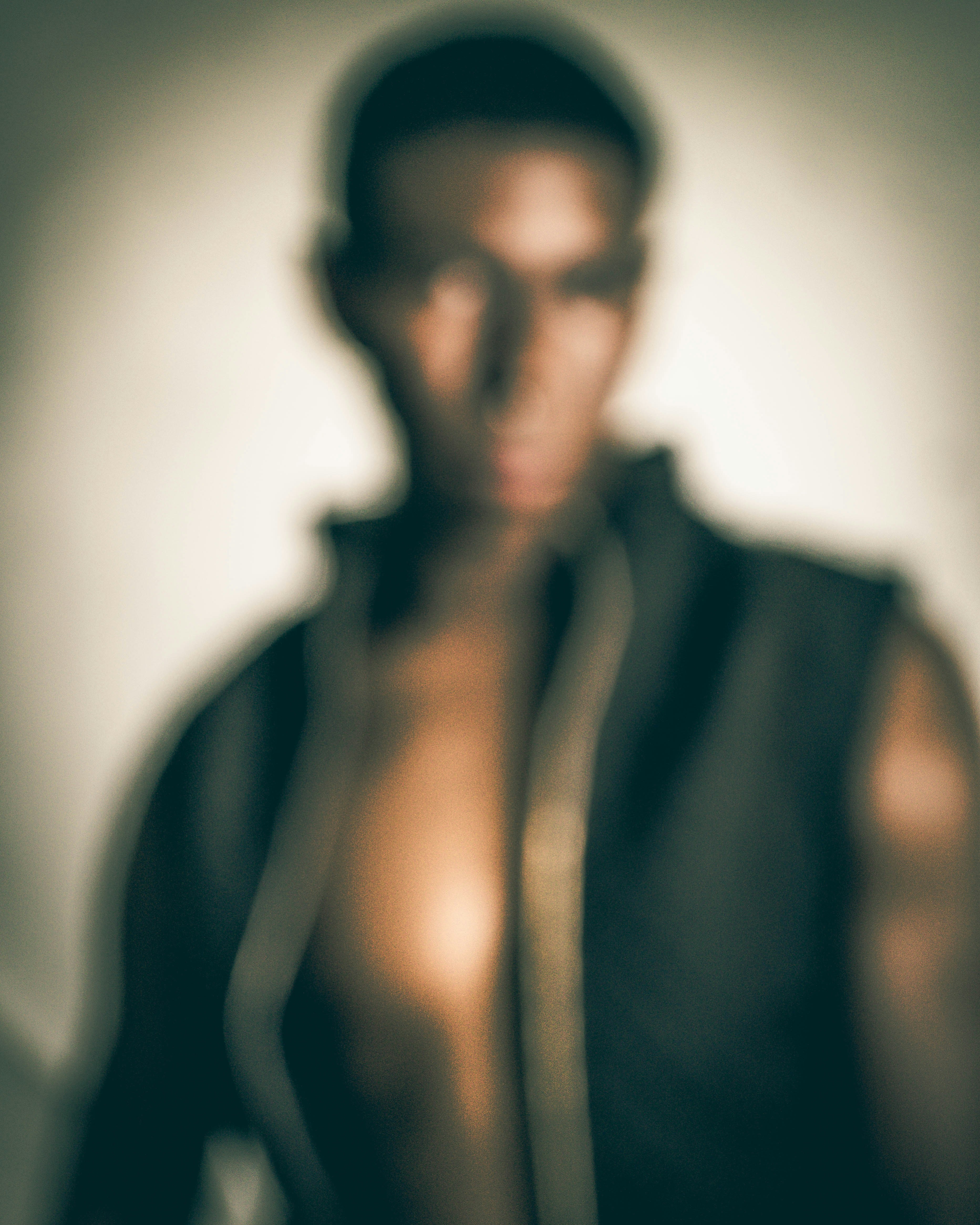 Veiled Presence: A Portrait of Shadow and Form