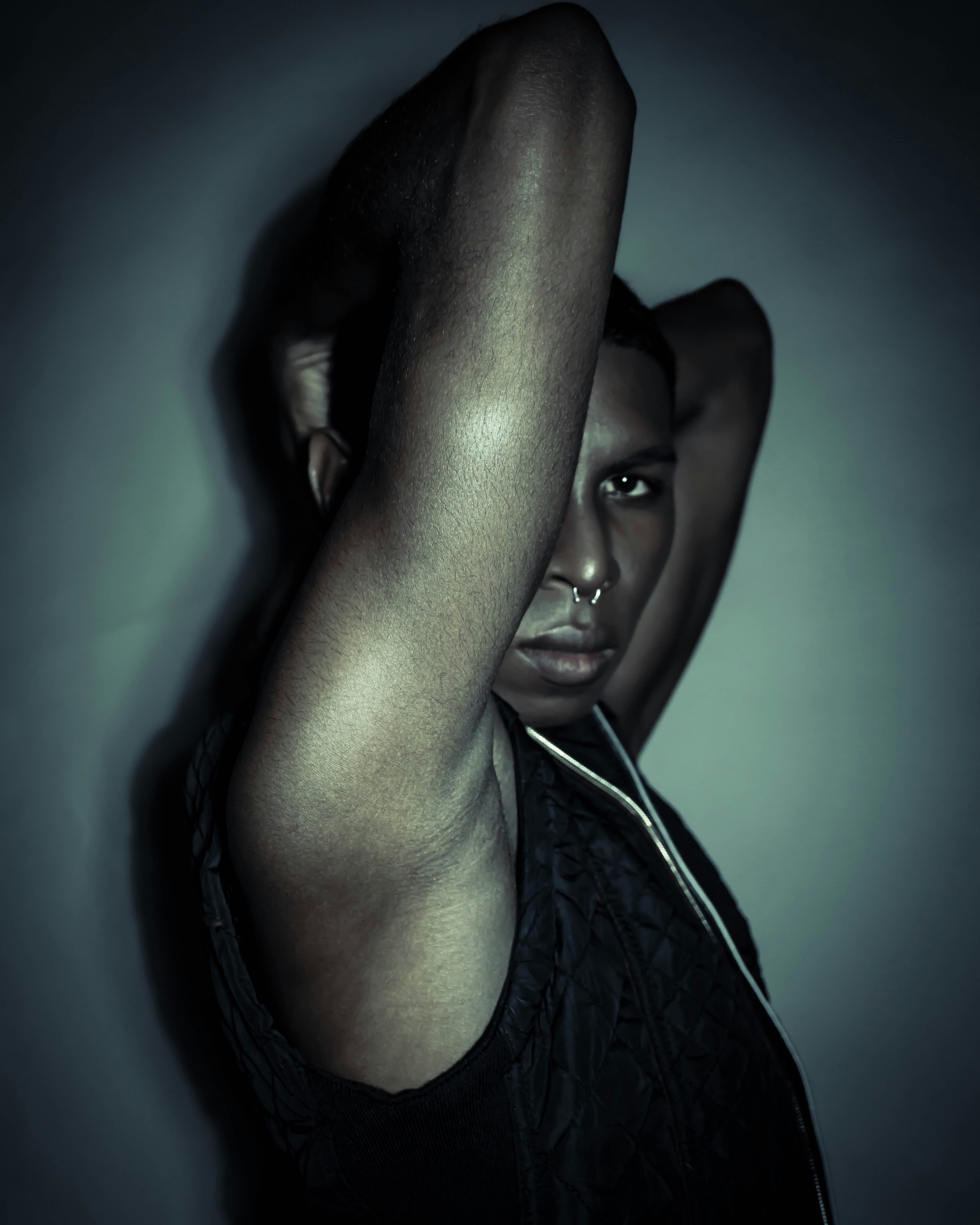 Shadowed Gaze: AContour of Strength Beneath the Narrow Light