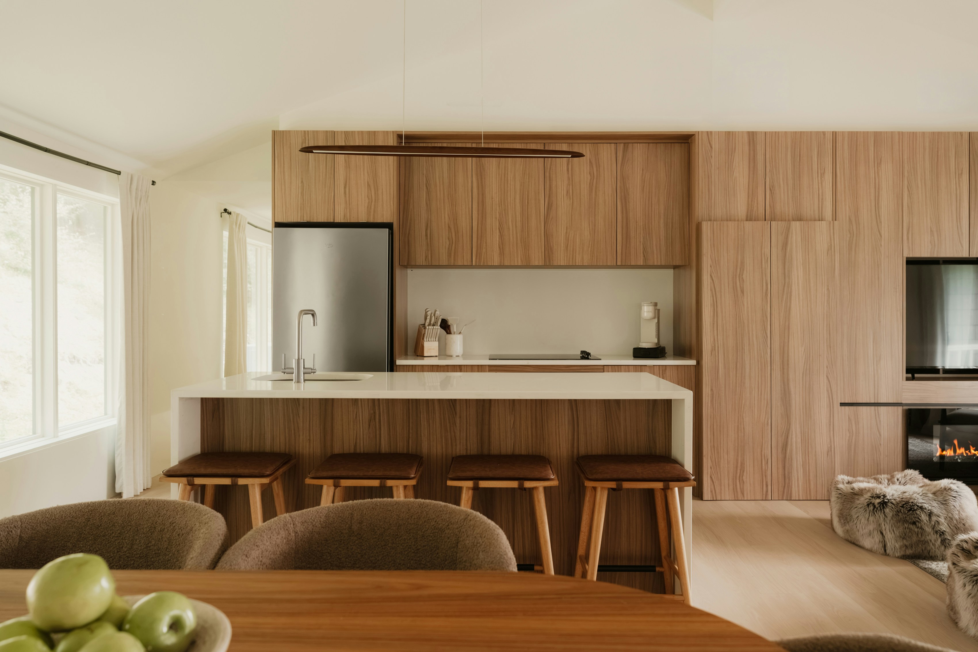 Minimalist Kitchen Overlooking a Warm Living Space