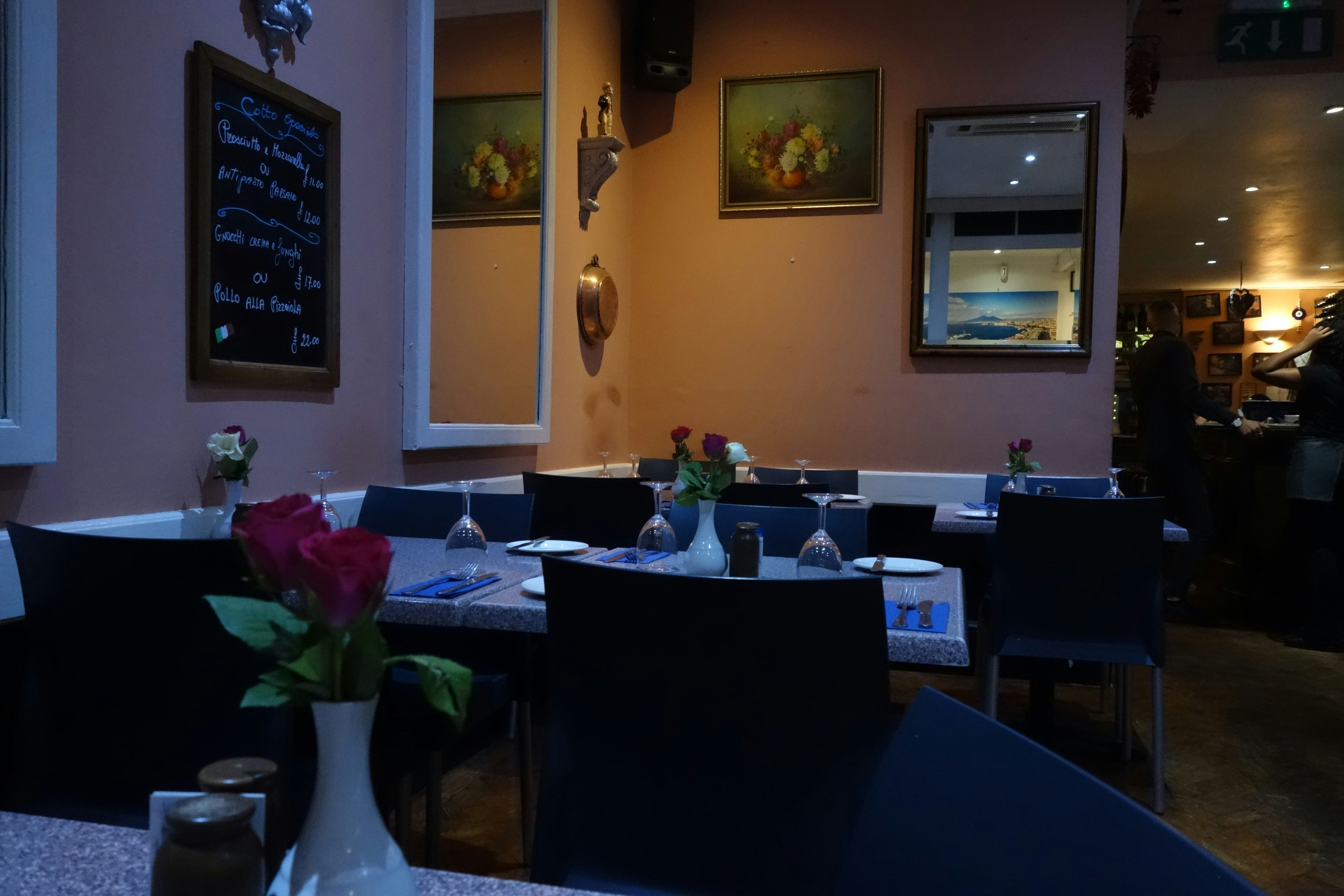Dimly Lit Bistro: Tables Set for Evening Chats