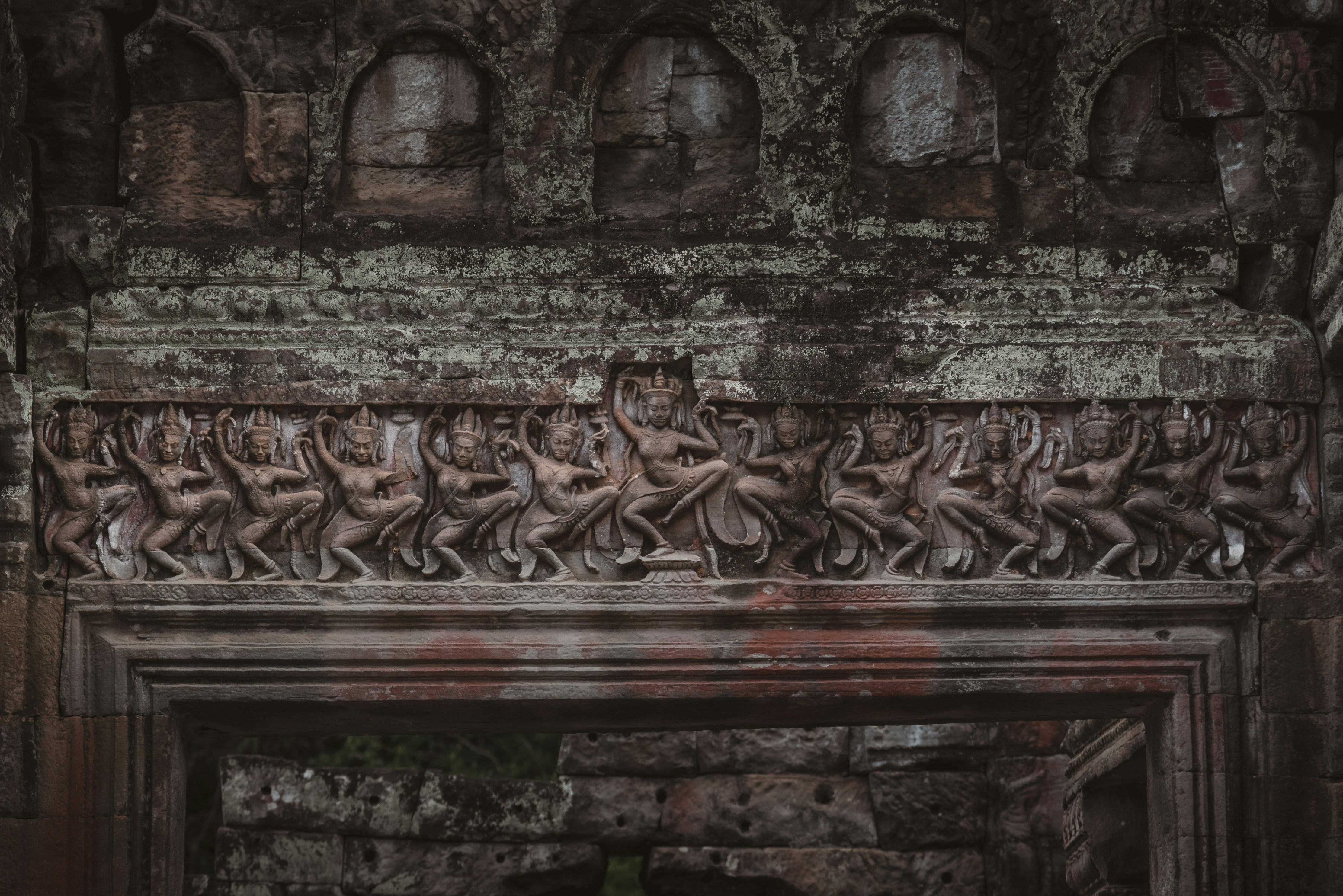 Carved Guardian Frieze Above an Ancient Gate