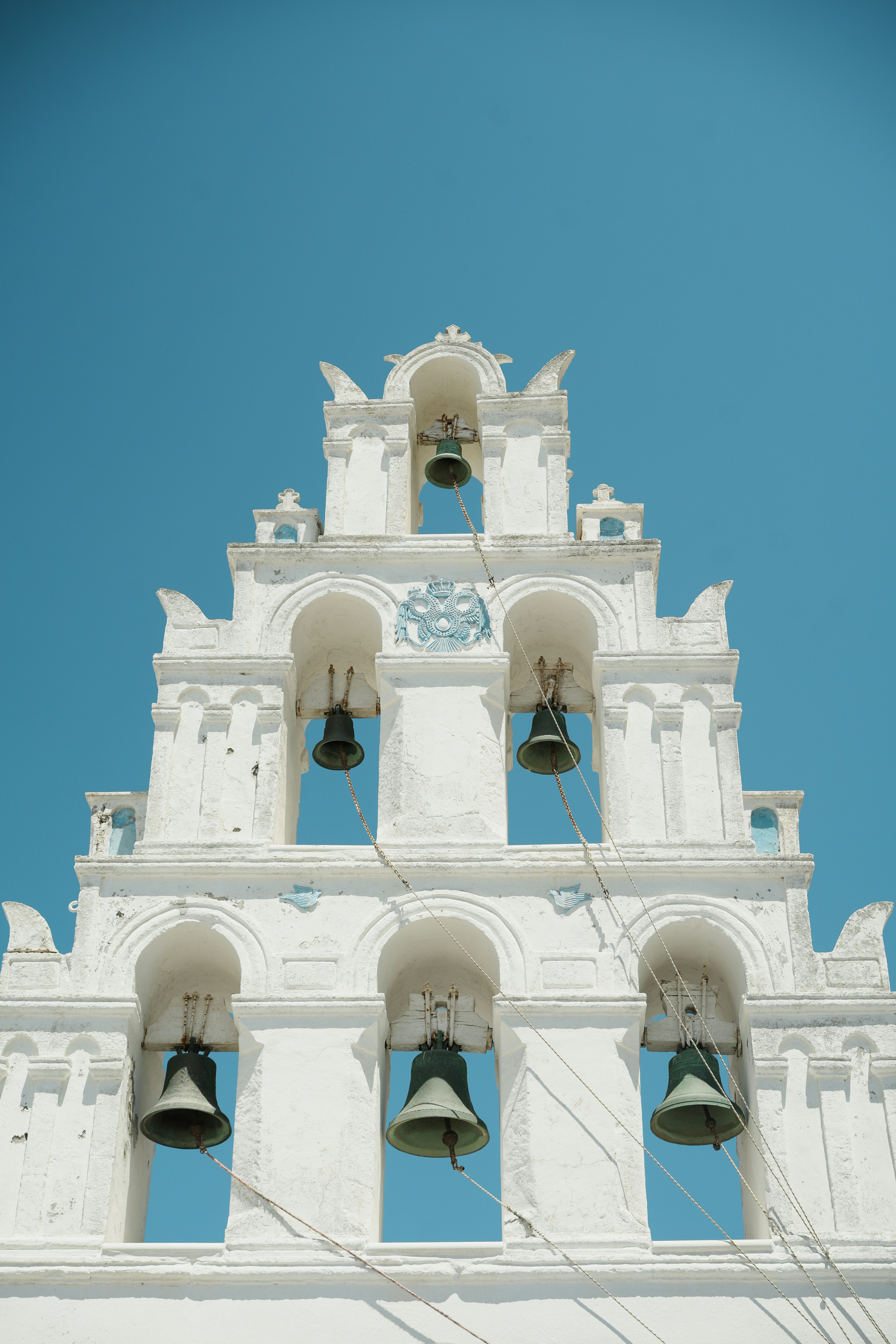 White Bells at Sunset: A Tiered Chapel Tower Reaching Toward a Clear Sky