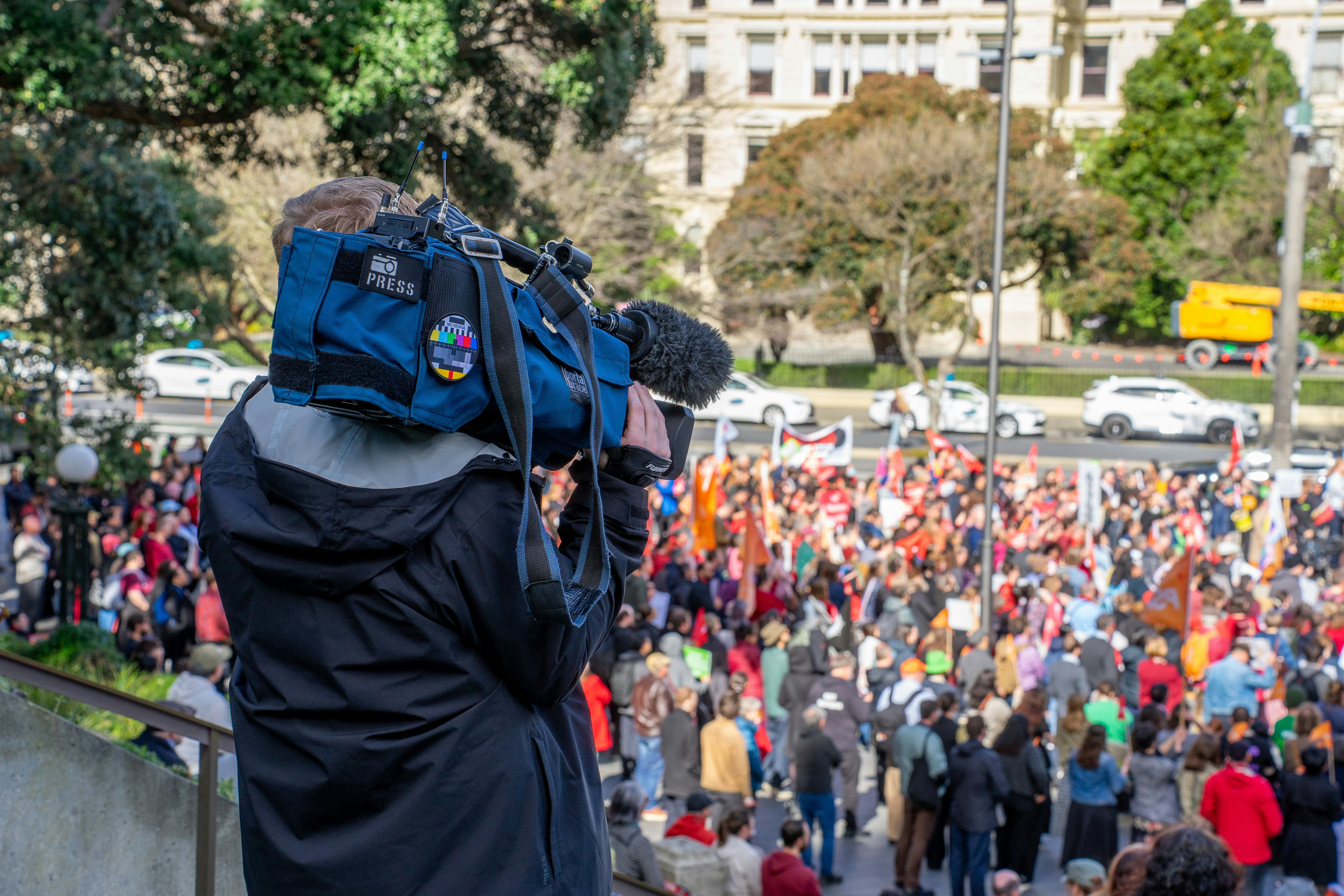 Front-Row Witness: A News Cameraman Capturing a Rally