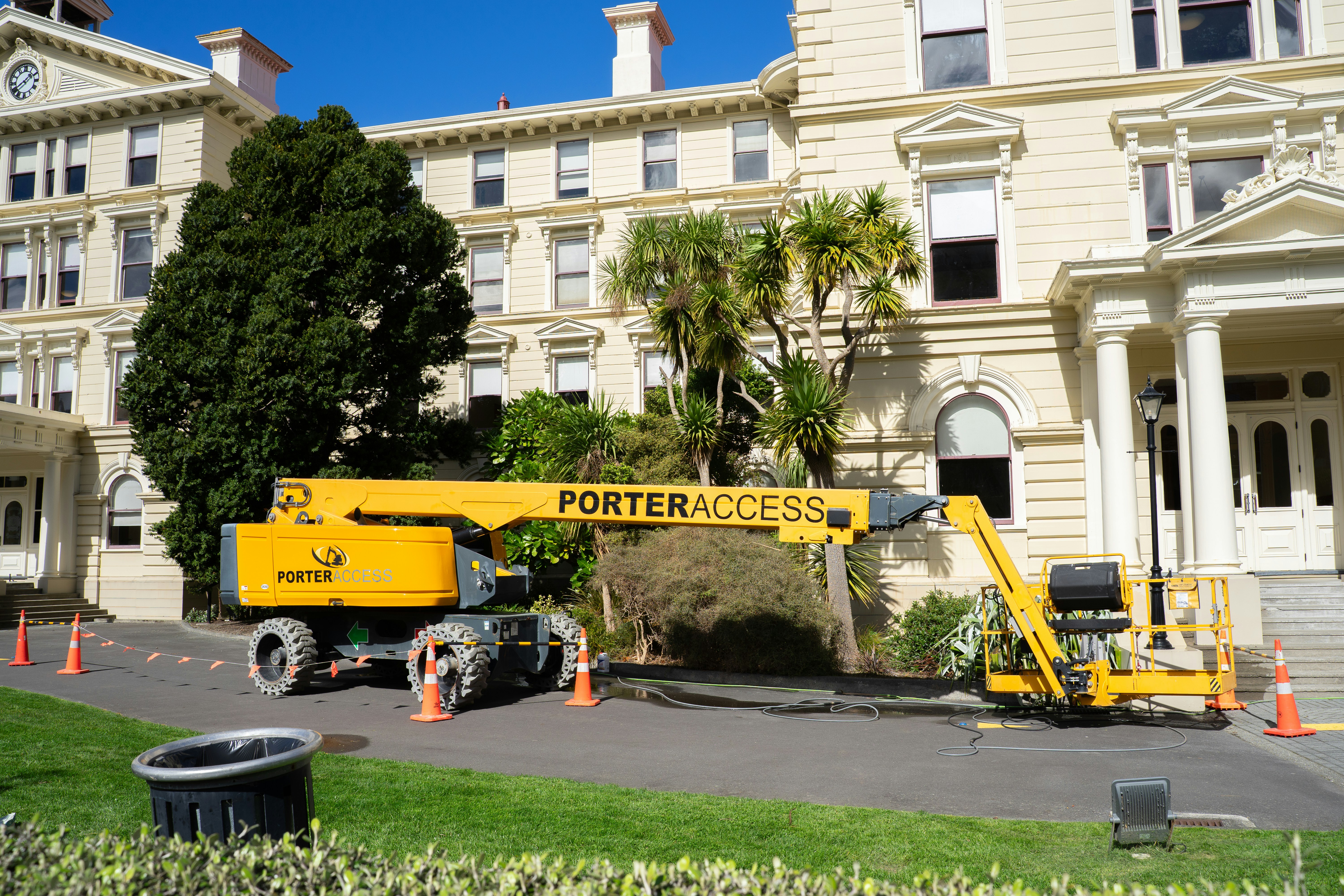 Ladder Crane at an Elegant Estate: A Momentary Construction Pause Framed by Classical Architecture