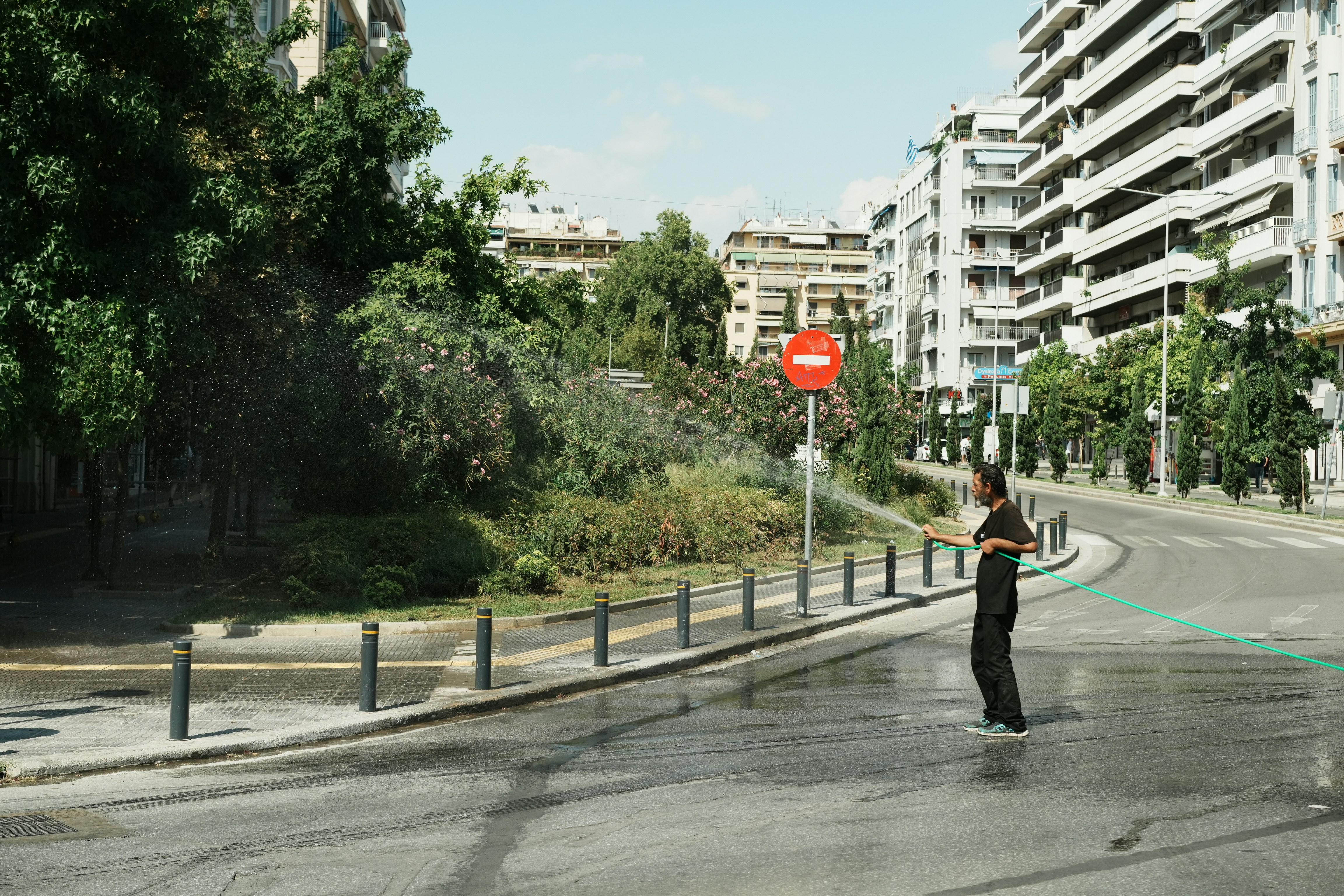 Crossing Gaze: A Pedestrian Pause at a Quiet Urban Bend