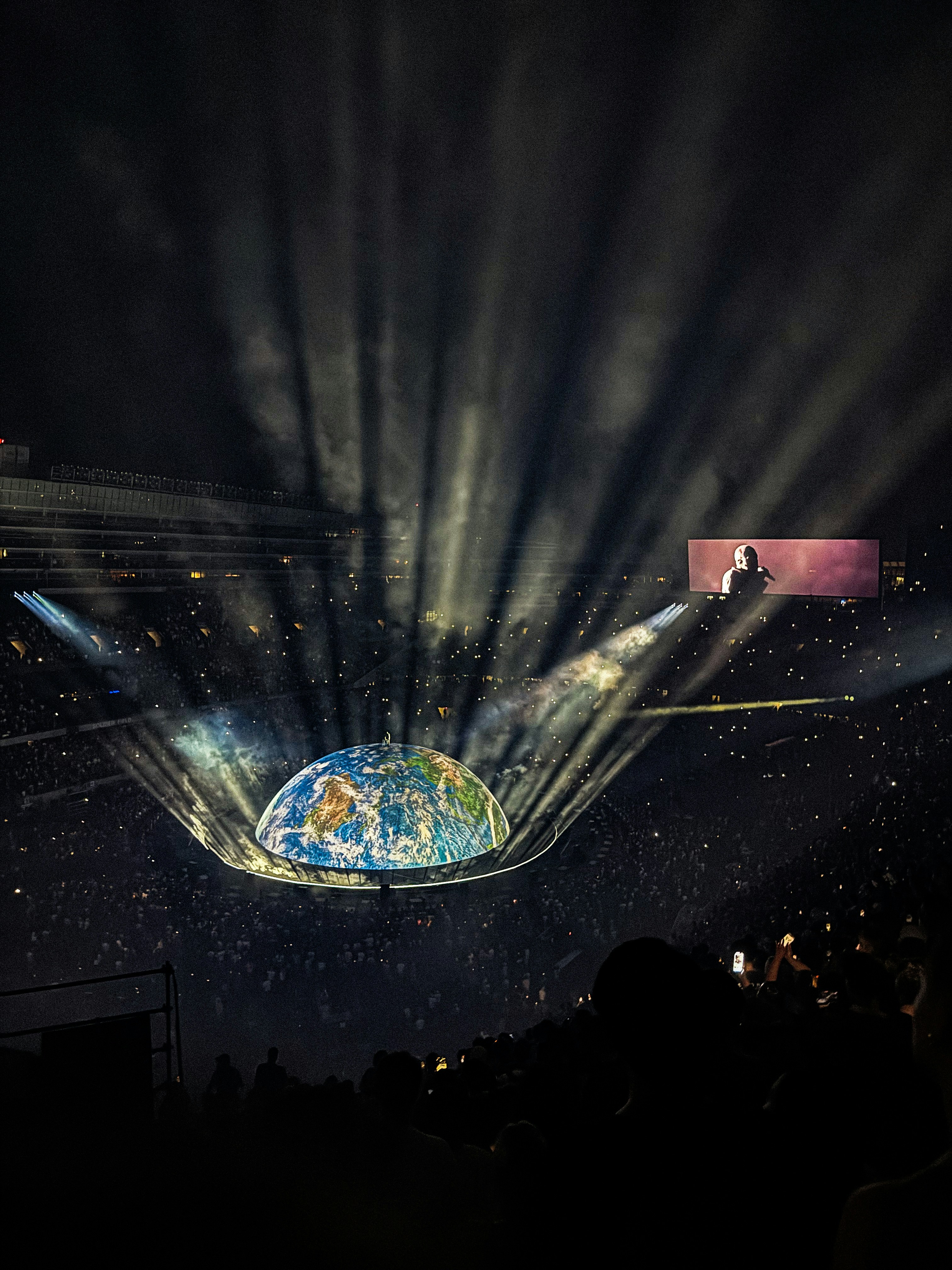 Earth on Stage: Globe spotlight in a celestial arena