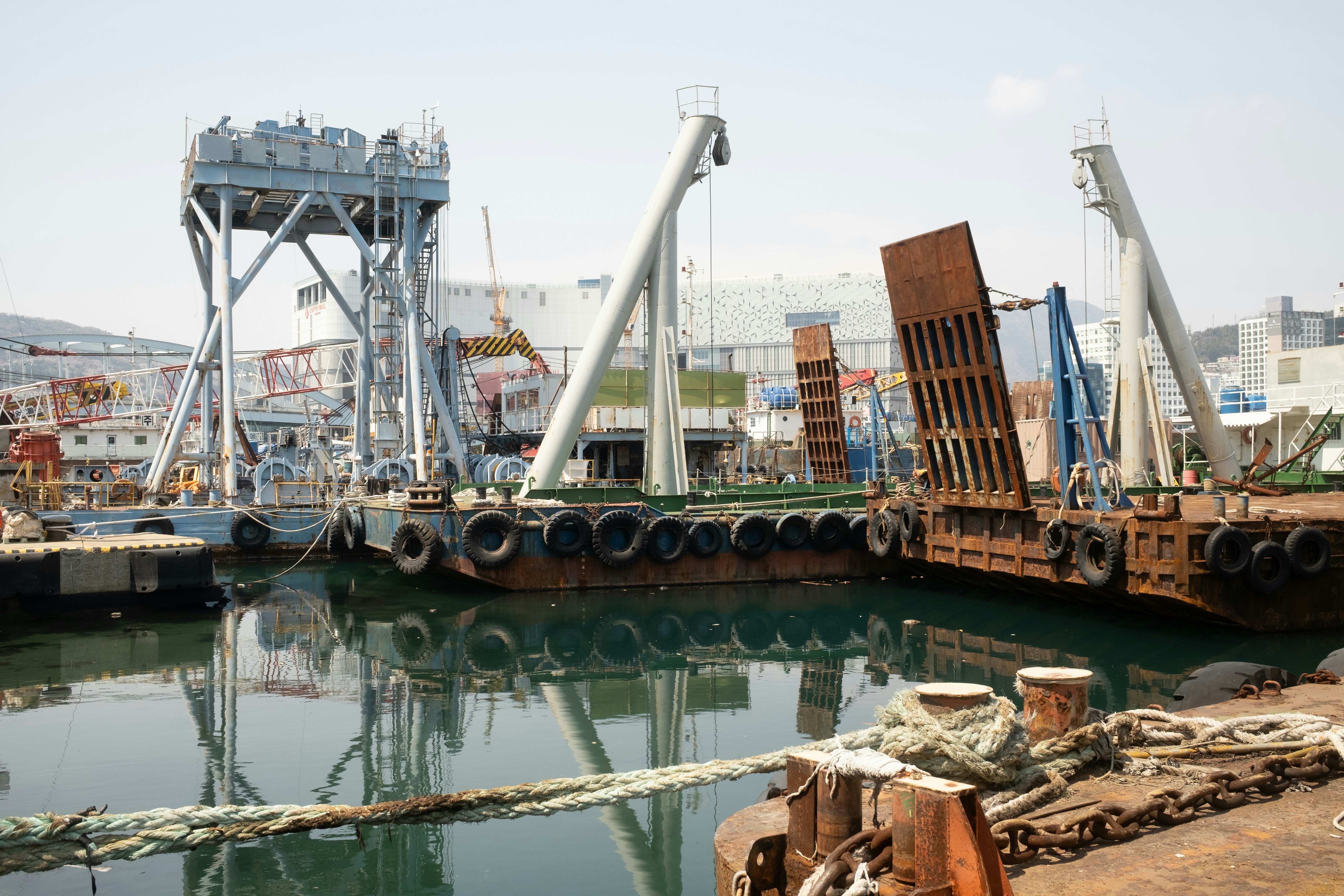 Rusted contraptions at the dock: a harbor of aging steel and weathered rails