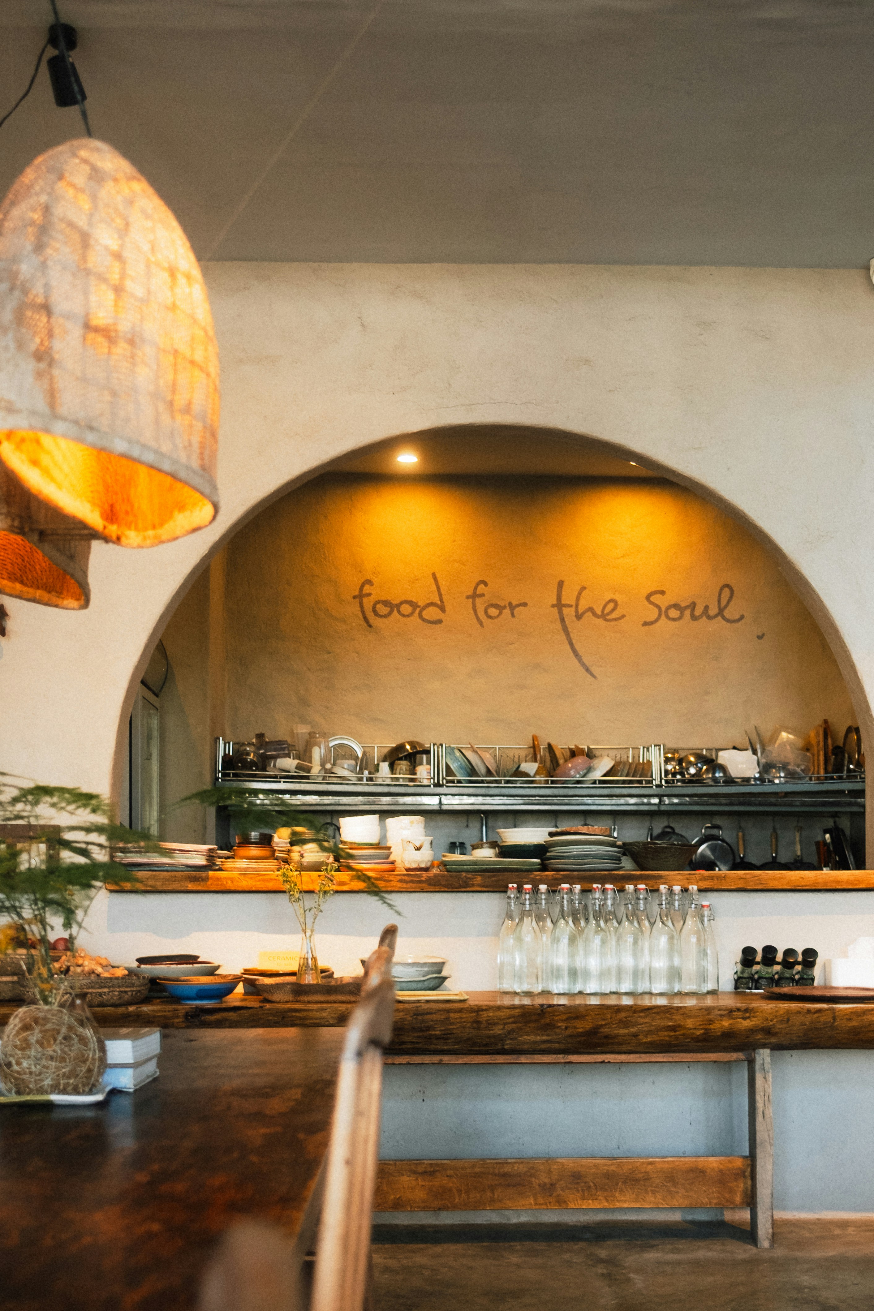 Arcade of Warm Light and Shared Plates