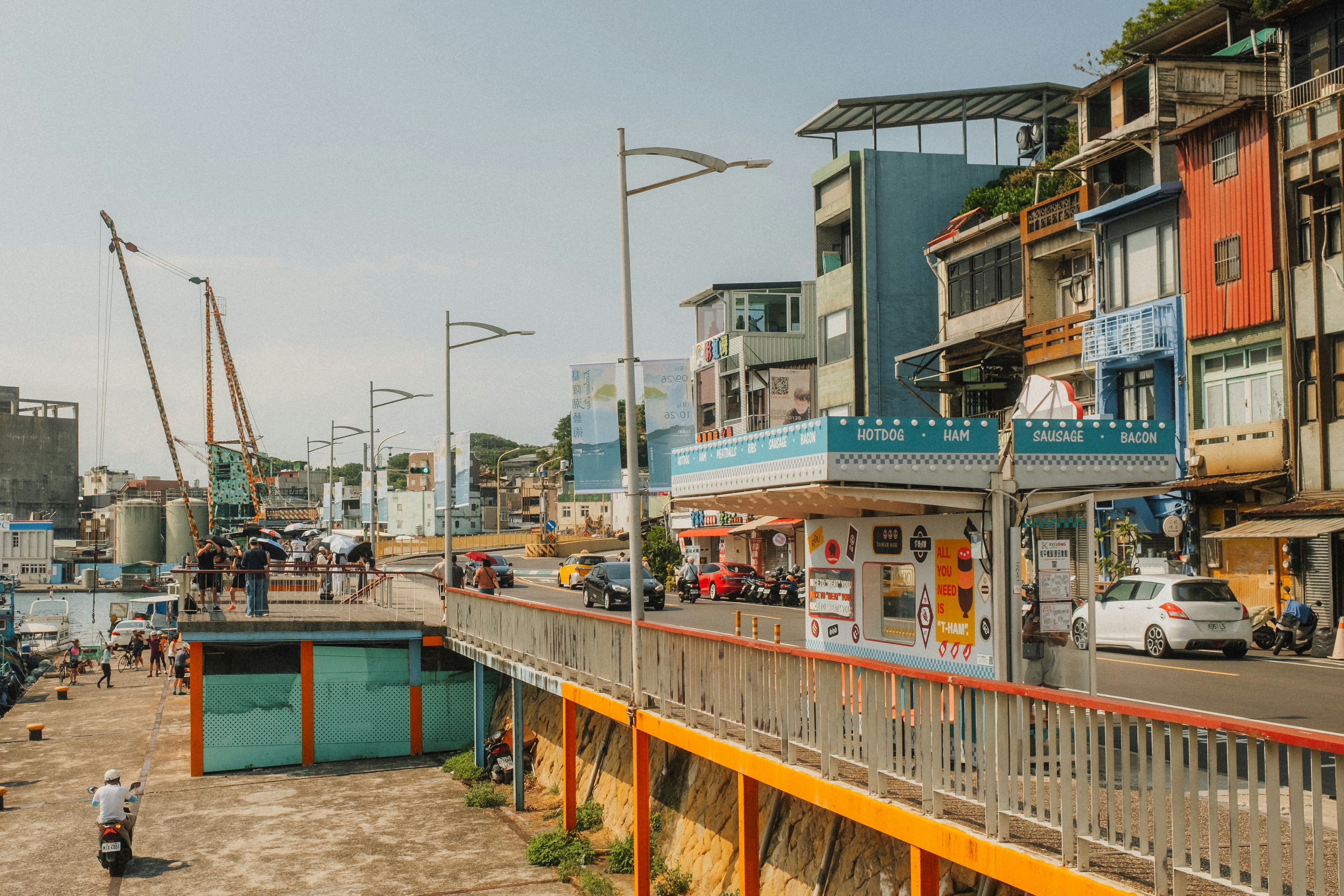 Harbor Street: Colorful storefronts Watch Over a Sloping Boardwalk