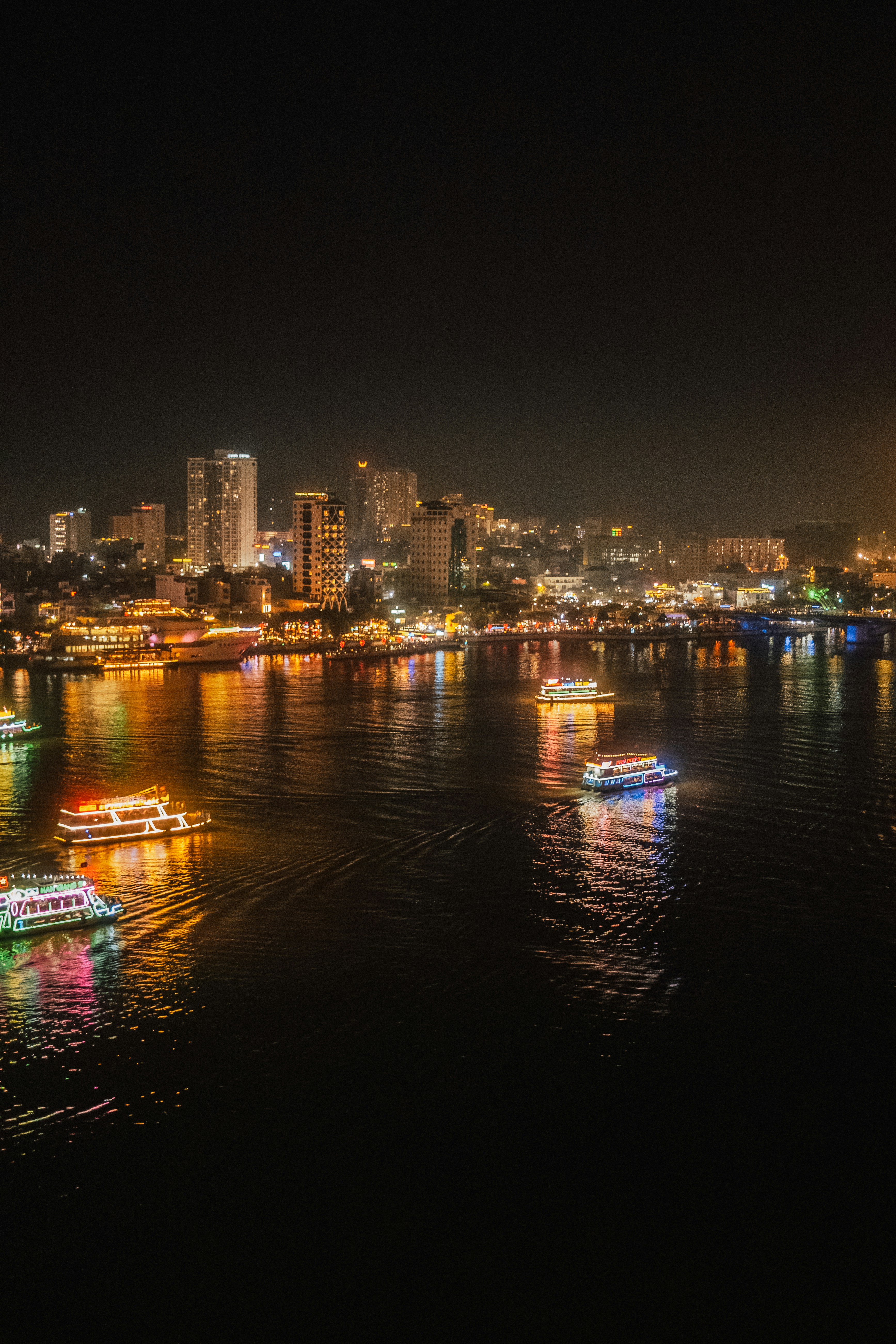 Night River Horizon: City Lights Reflecting on the Water
