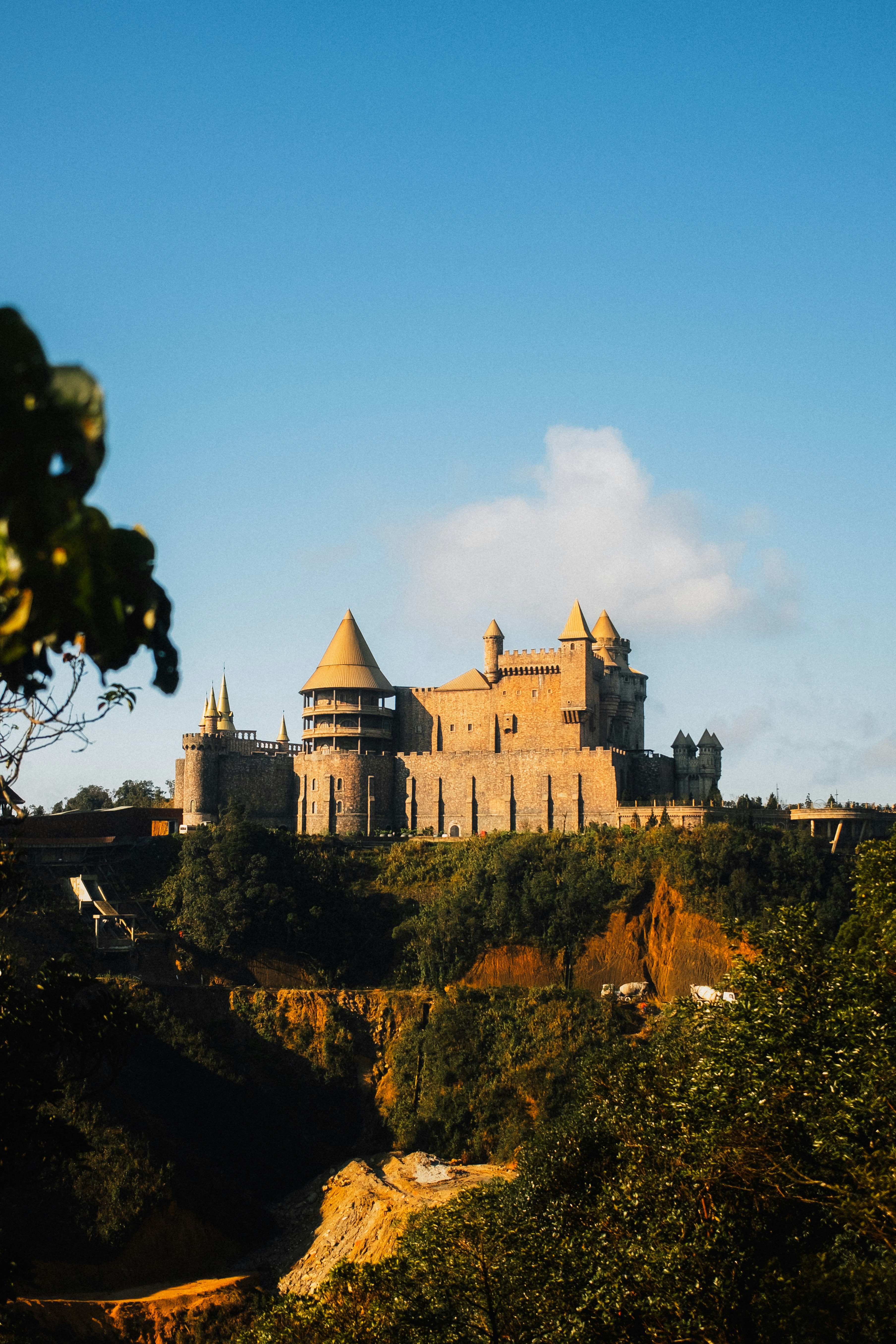 Stone Sentinels on a Horizon: A Castle Silhouette Under a Clear Sky