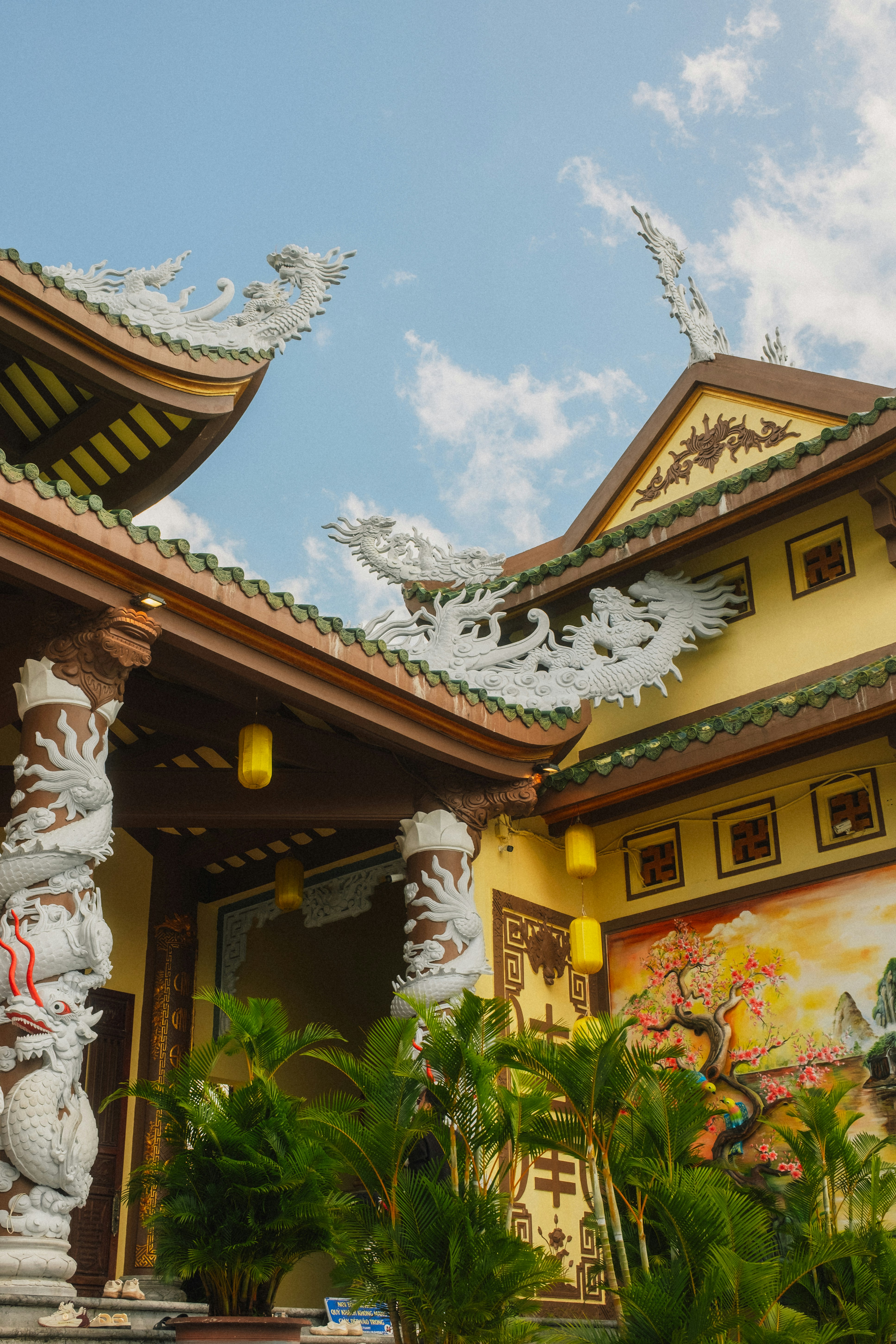 Dragon-carved Rooflines Framing a Golden Temple Entrance