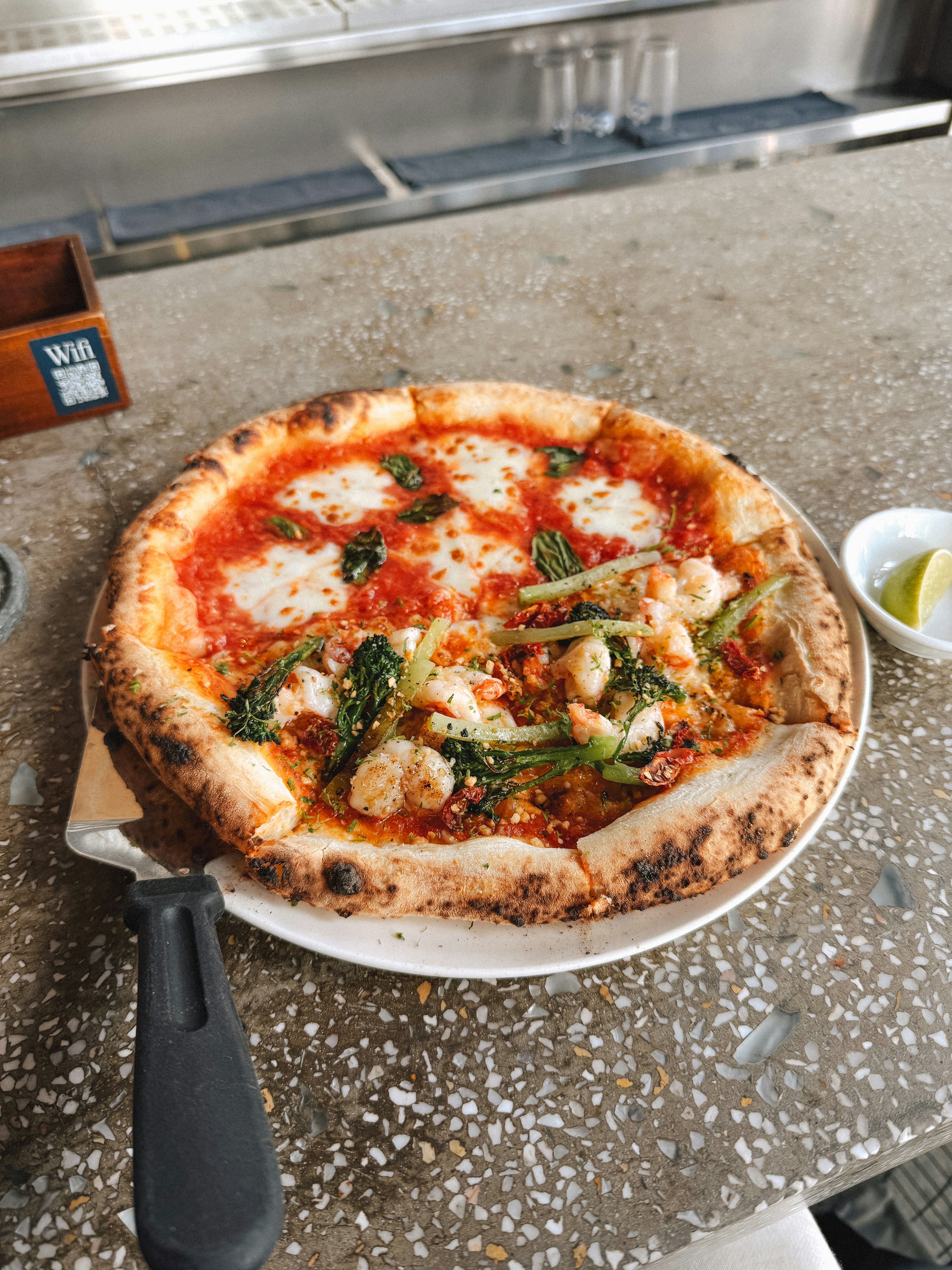 Wood-Fired Pepperoni and Shrimp Pizza on a Textured Counter