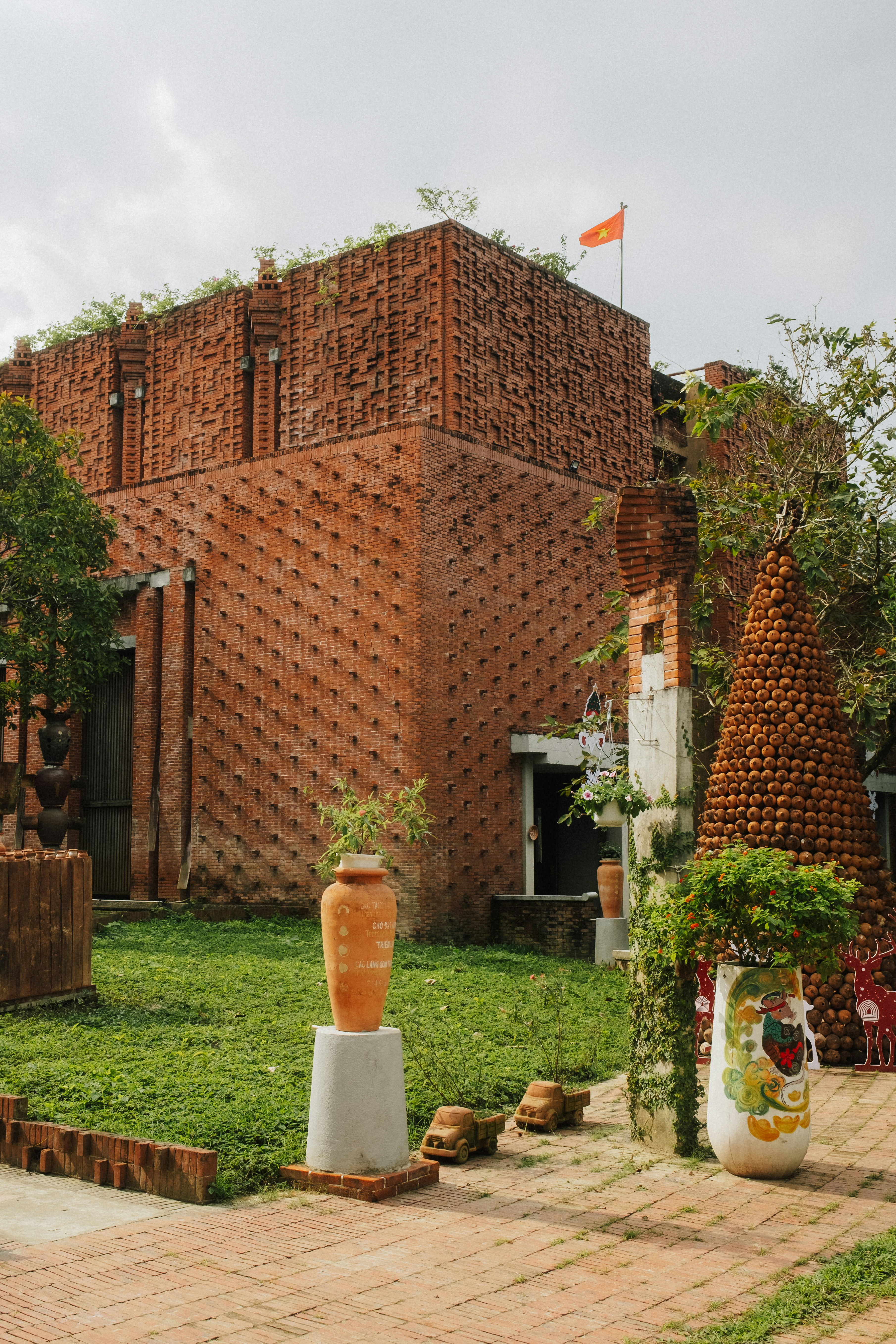 Terracotta Gallery: A Red Brick Courtyard with Ceramic Masterpieces