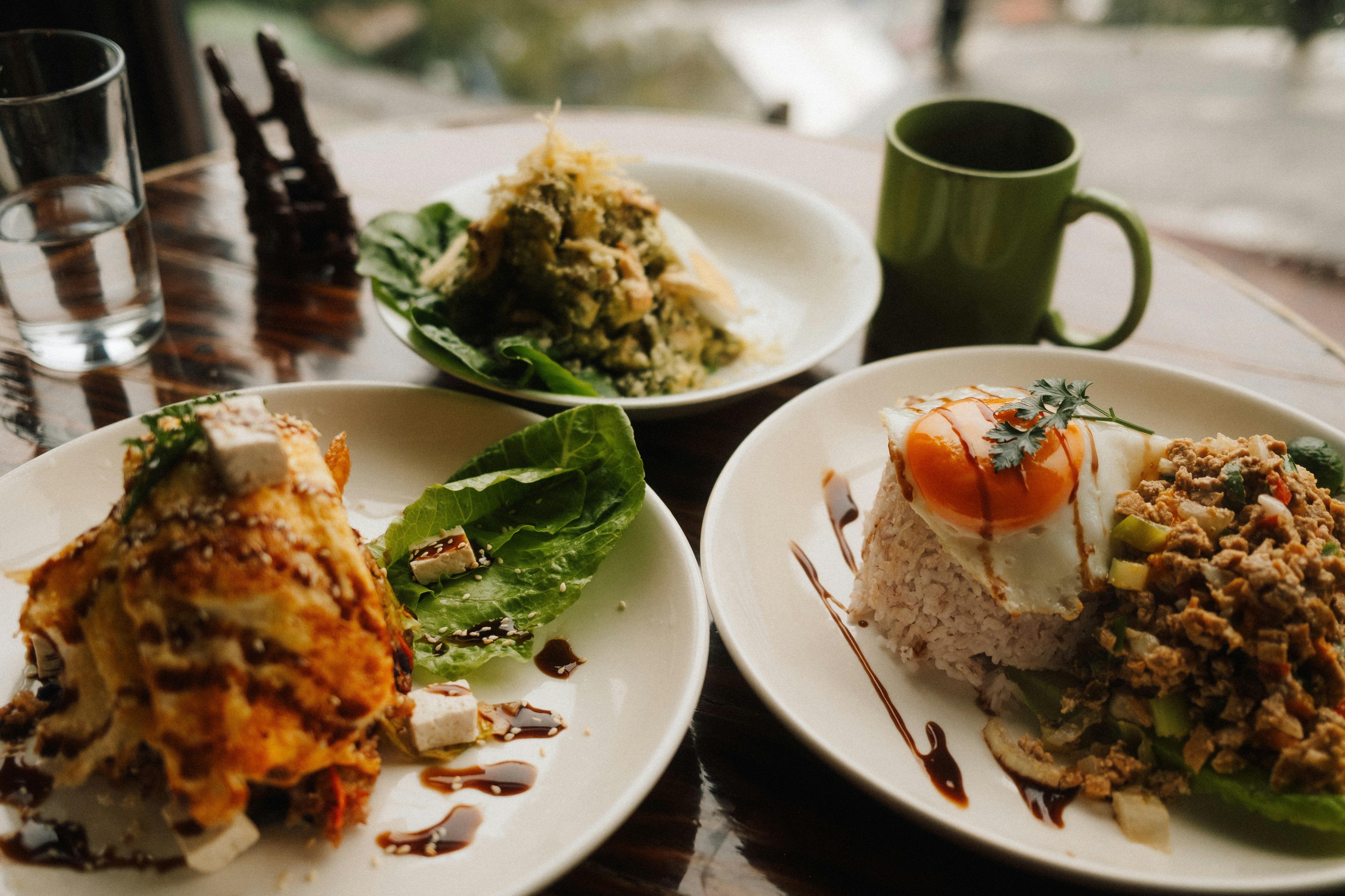 Triad of Treats: A Café Table Sophisticated with Colorful Plates