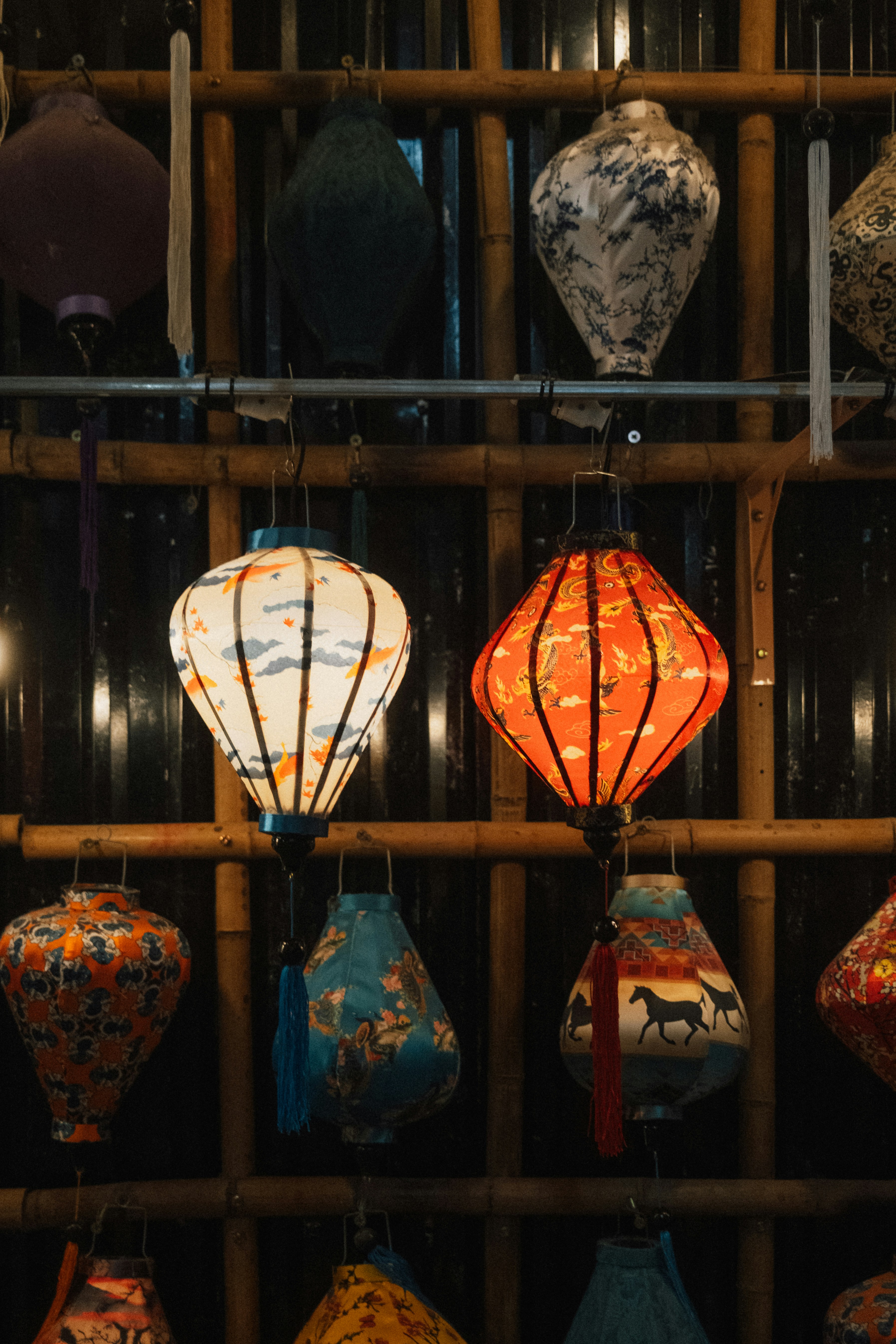 Illuminated Lantern Orchard: A Row of Painted Luminaries in a Wooden Framework
