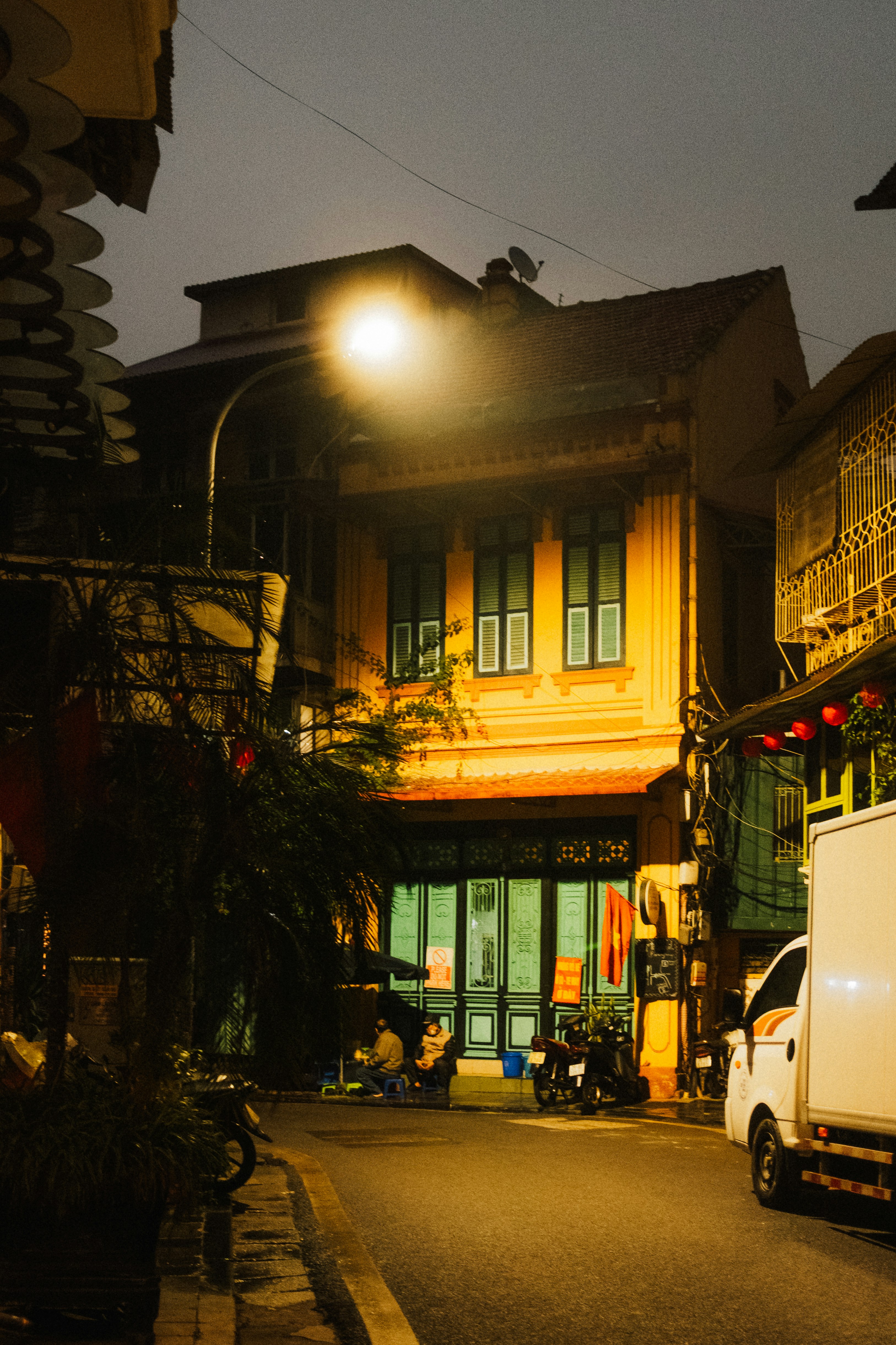 Warm Street Glow on a Southeast Asian Streetfront