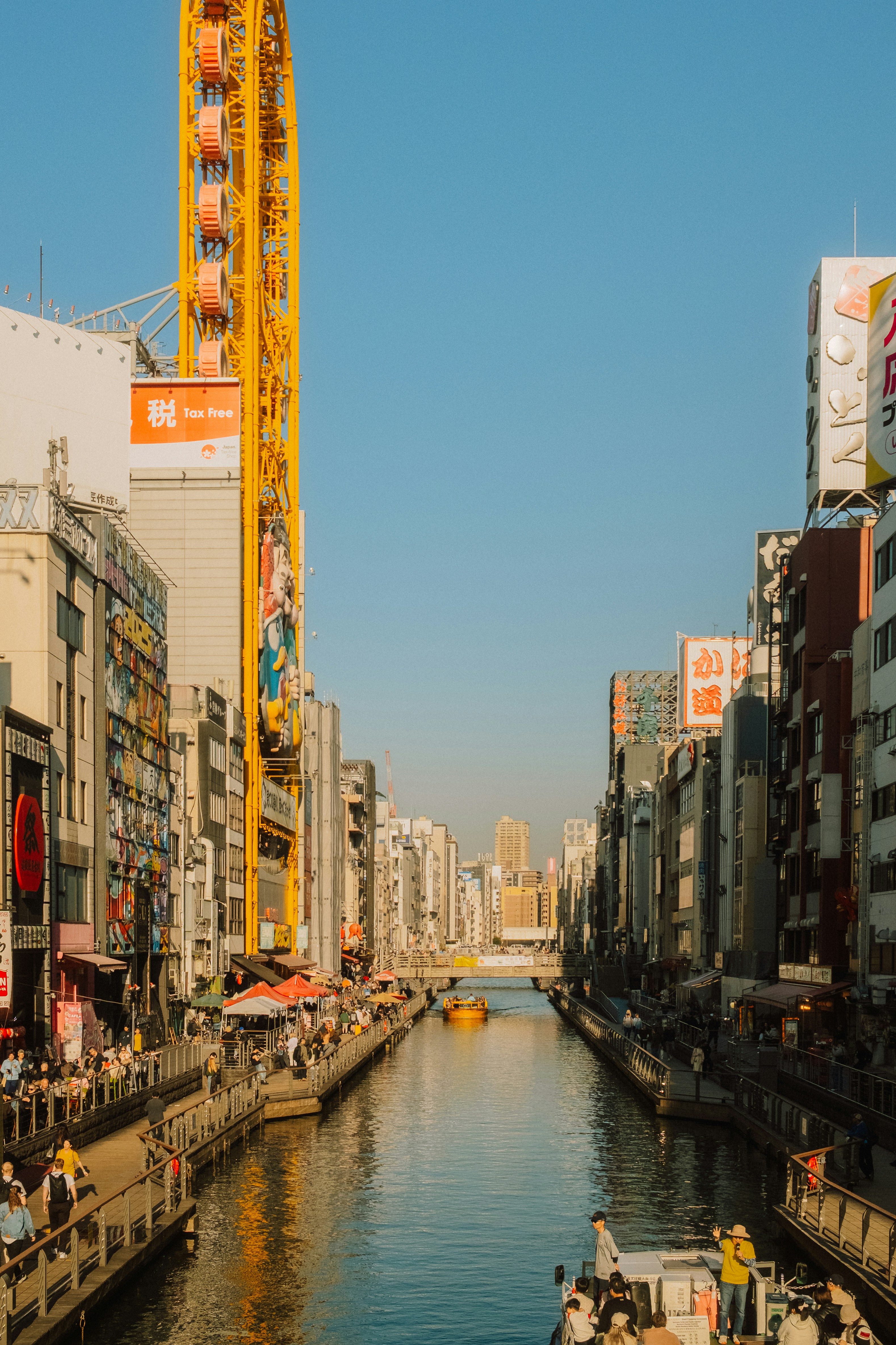 Riverwalk in Neon Light: Tokyo-style Canal Amid Shimmering Skyscrapers