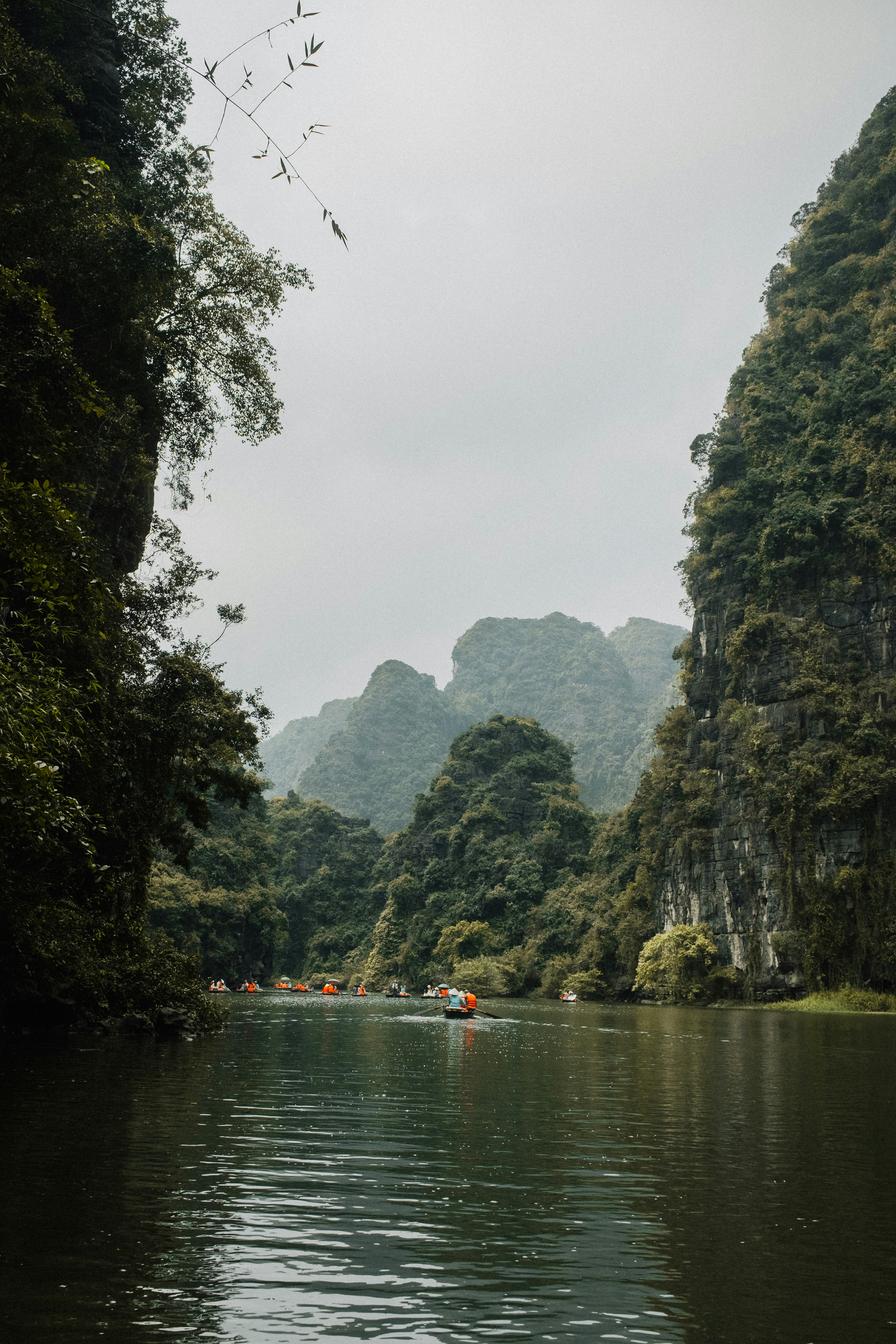 River of Carved Peaks: Boats Drift Through a Limestone Gorge