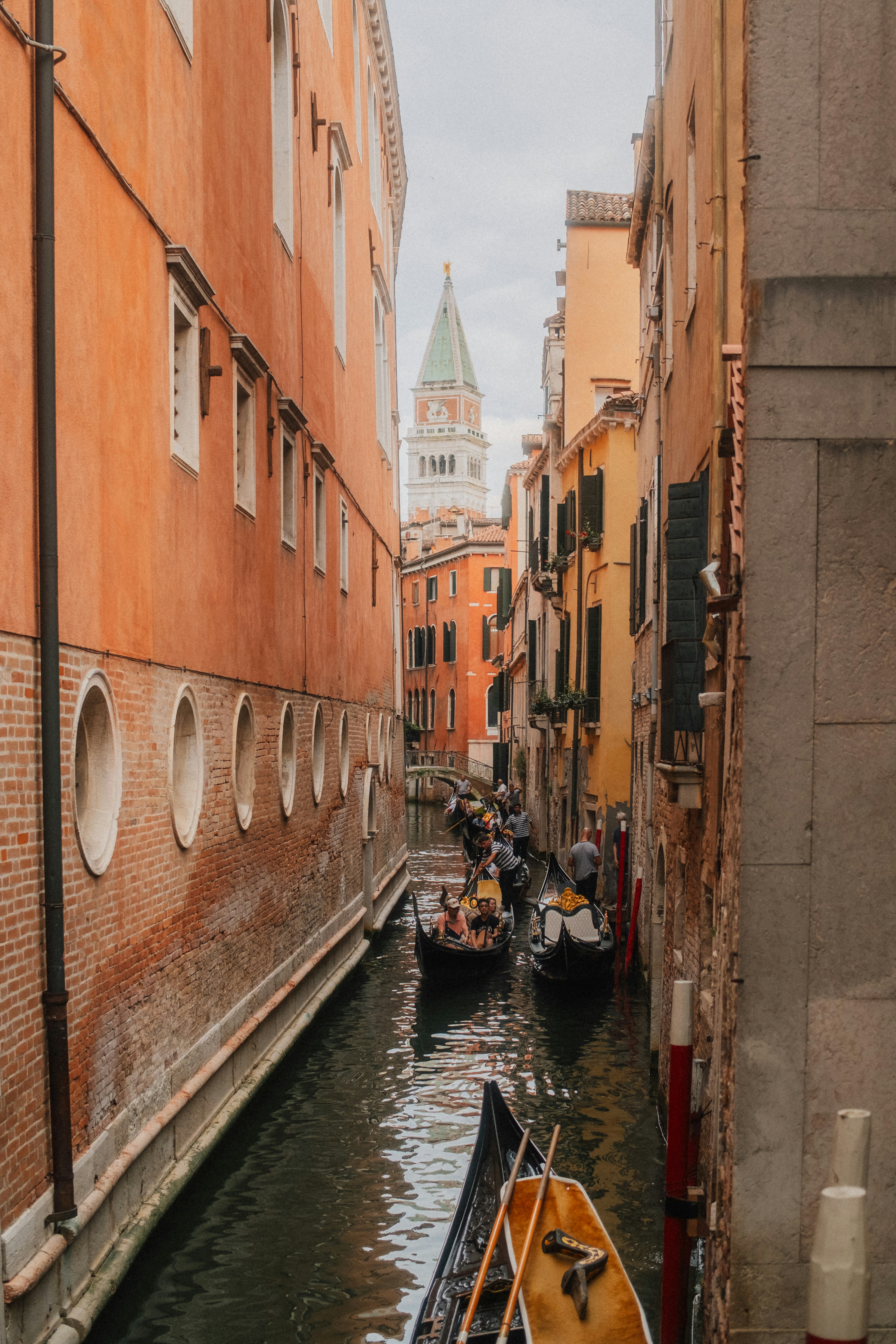 Gondolas in a Venetian Channel Framing a Clock Tower