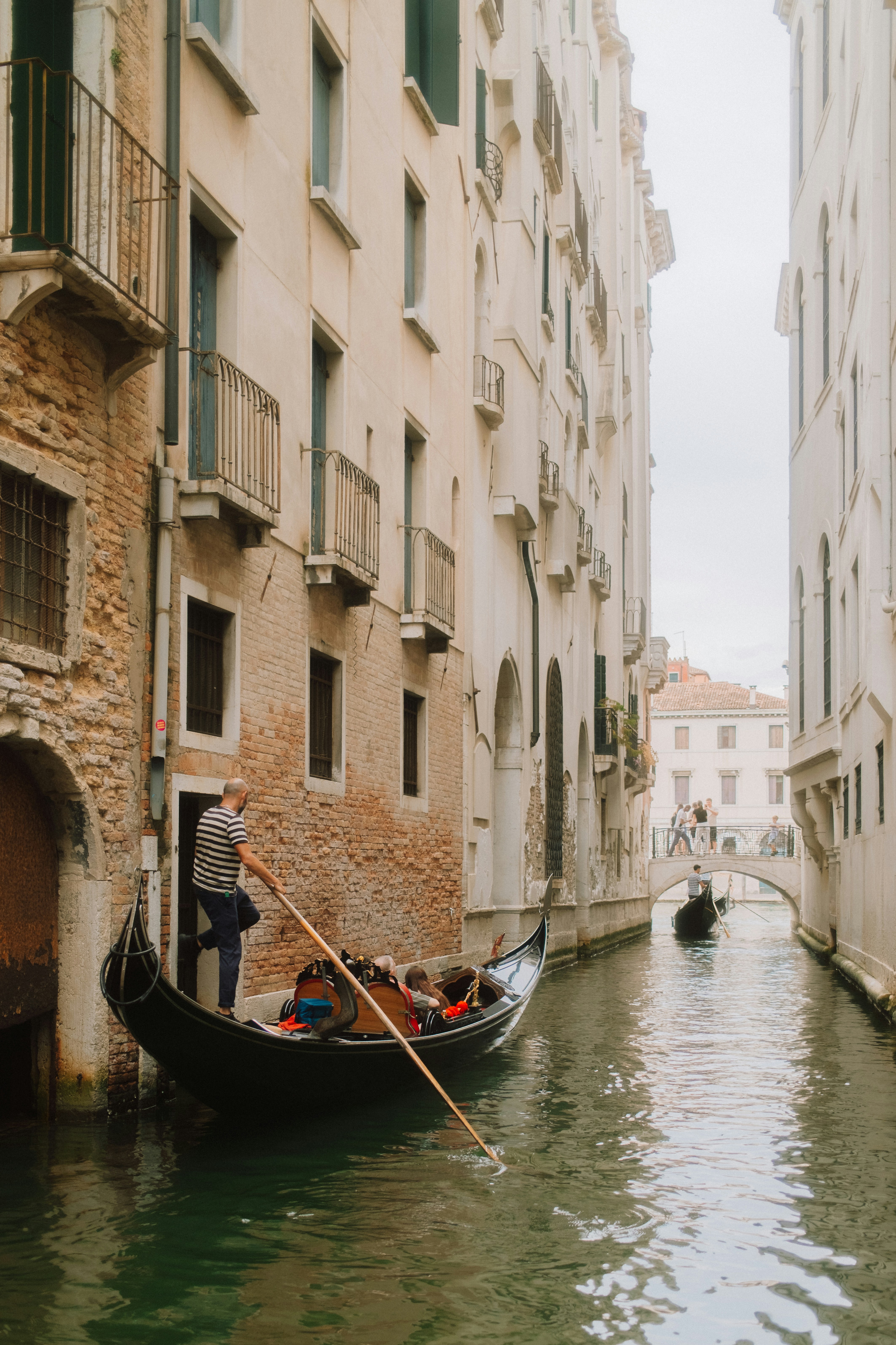 Gondola Passage: Narrow Canal Between Historic Facades