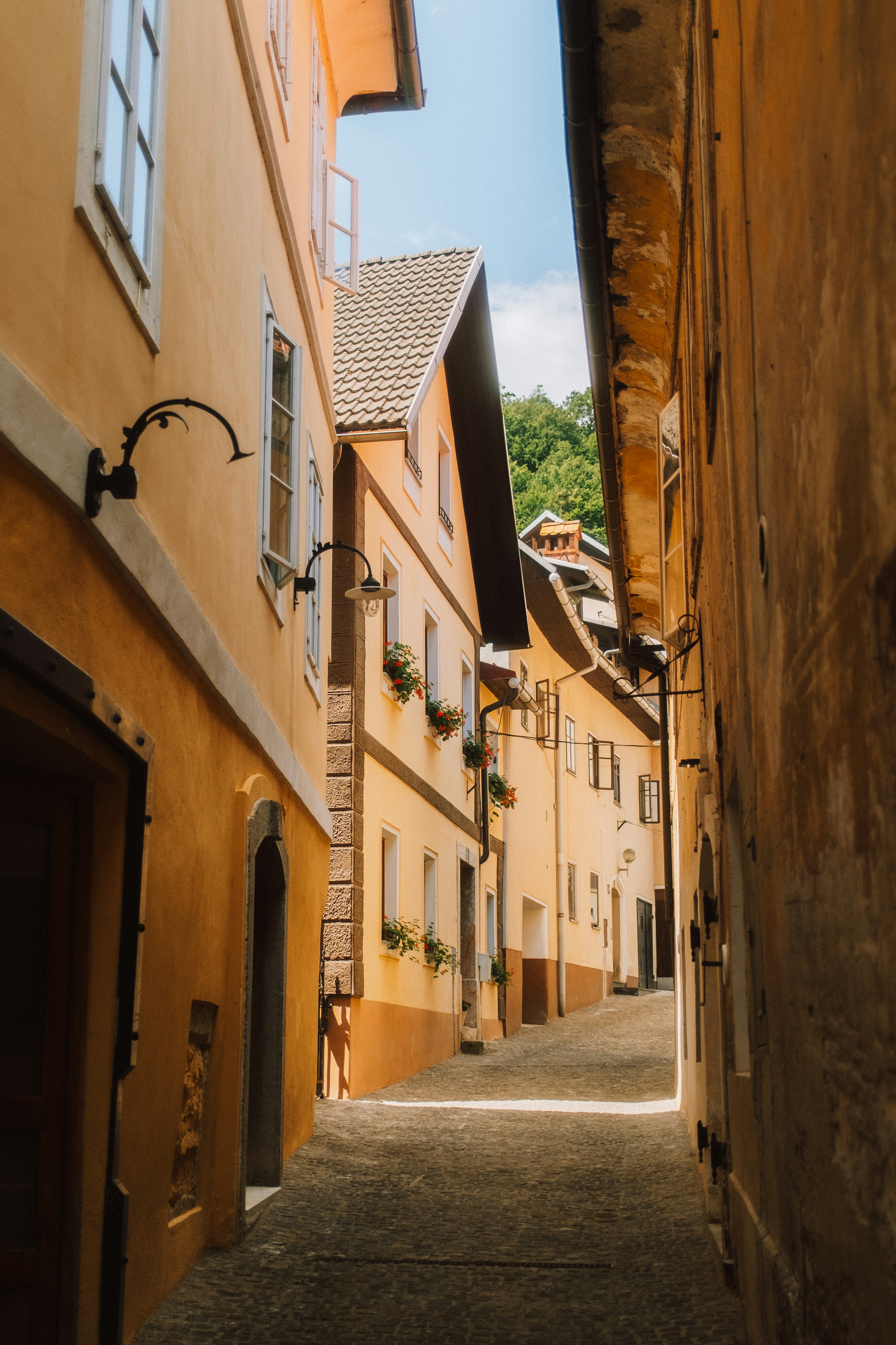 Sunlit Alleyways: Warm Facades and Shadowed cobbles