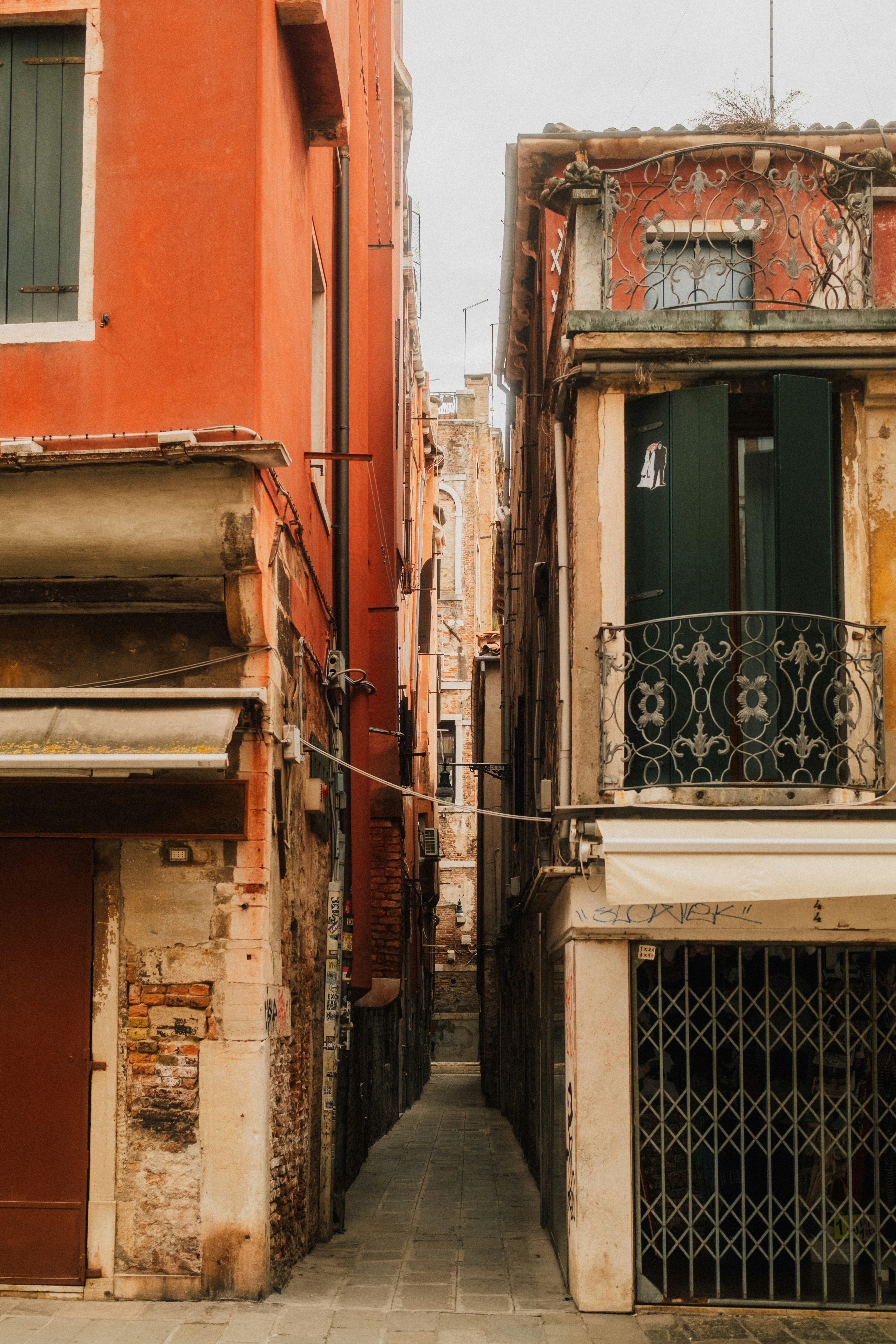 Narrow Alley Between Weathered Facades
