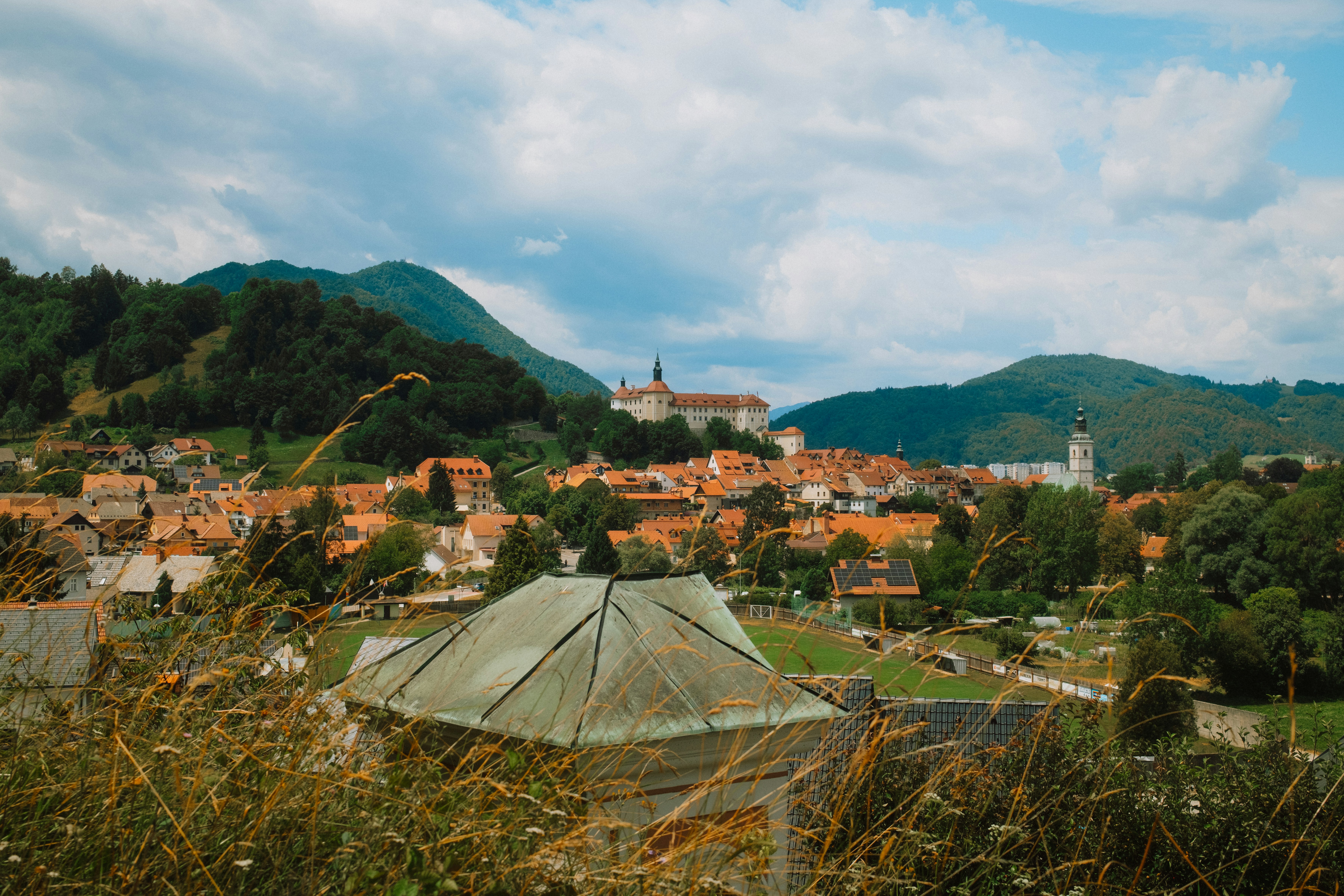 Village Overlook: A Dome, Rooftops, and Rolling Hills