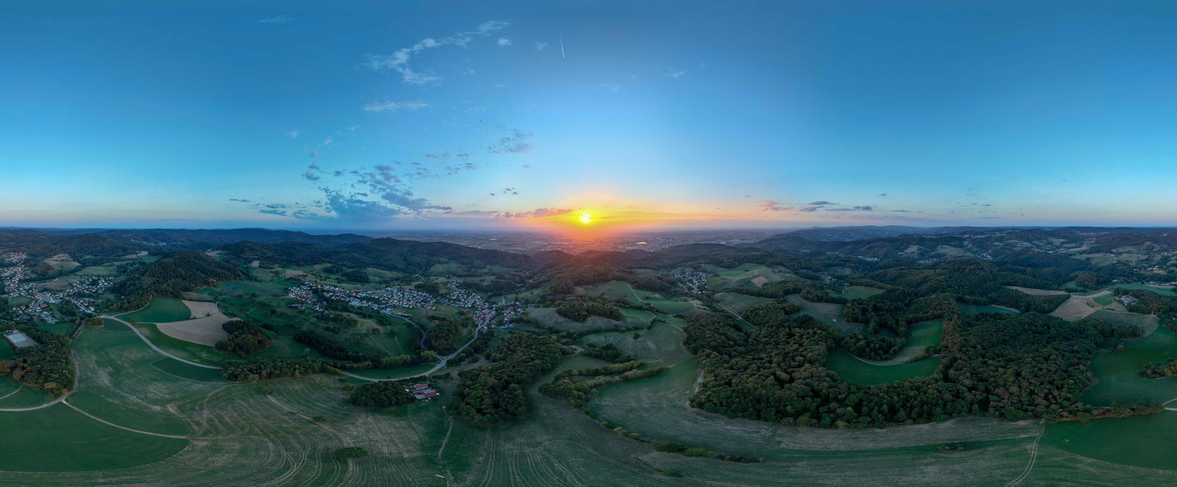 Dawn Over Verdant Valleys: A Seamless Panoramic Sunrise